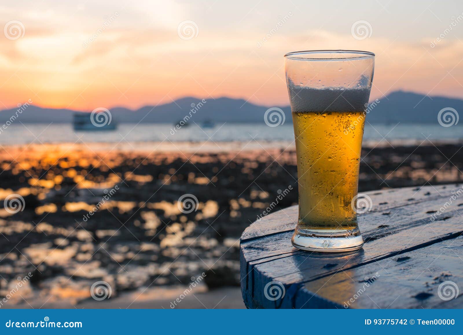 Glass of beer on a sunset stock photo. Image of drops - 93775742