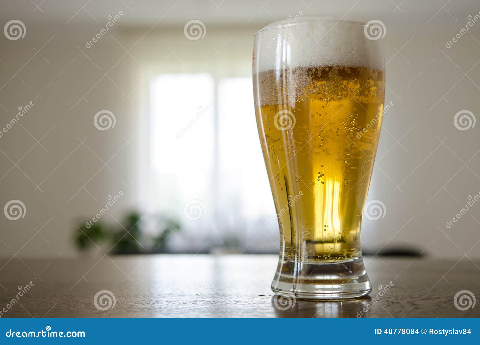Glass with Beer on the Table Stock Photo - Image of golden, cold: 40778084