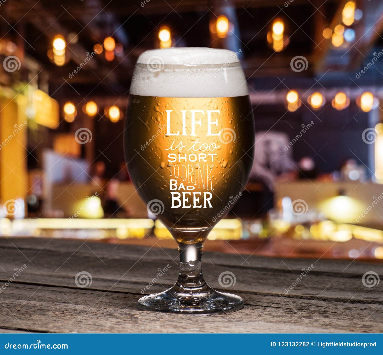 Glass of beer on table stock photo. Image of beverage - 123132282