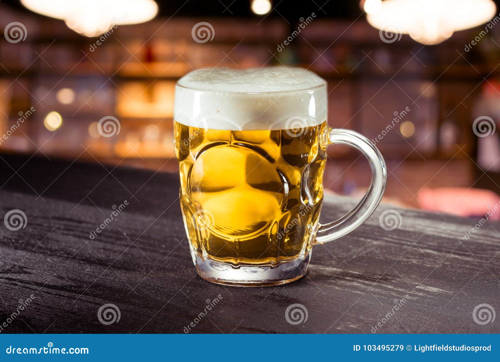 Glass of beer on table stock image. Image of booze, alcohol - 103495279