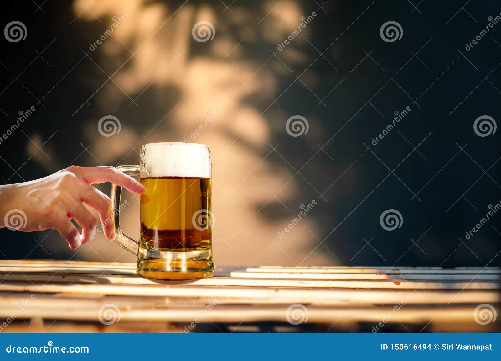 A Glass of Beer on Table in Summer Sunny Day. People Drinking Brew ...