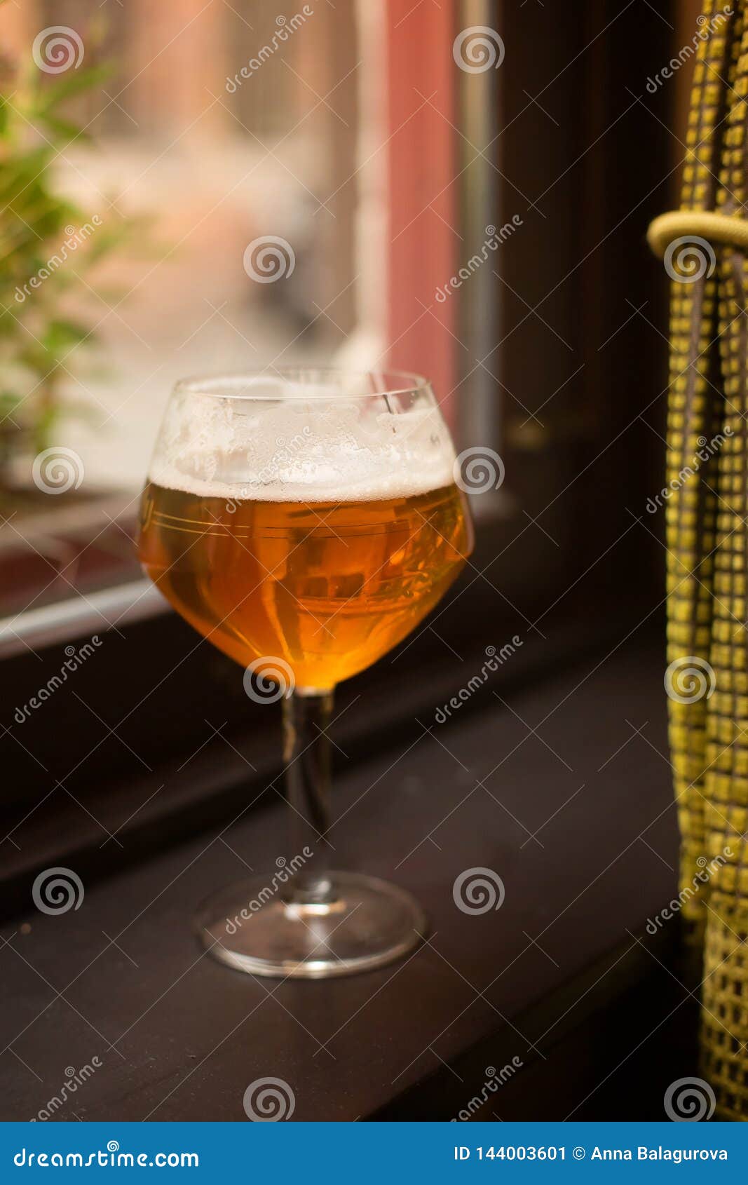 A Glass with Belgian Beer on the Window Stock Image - Image of lager ...