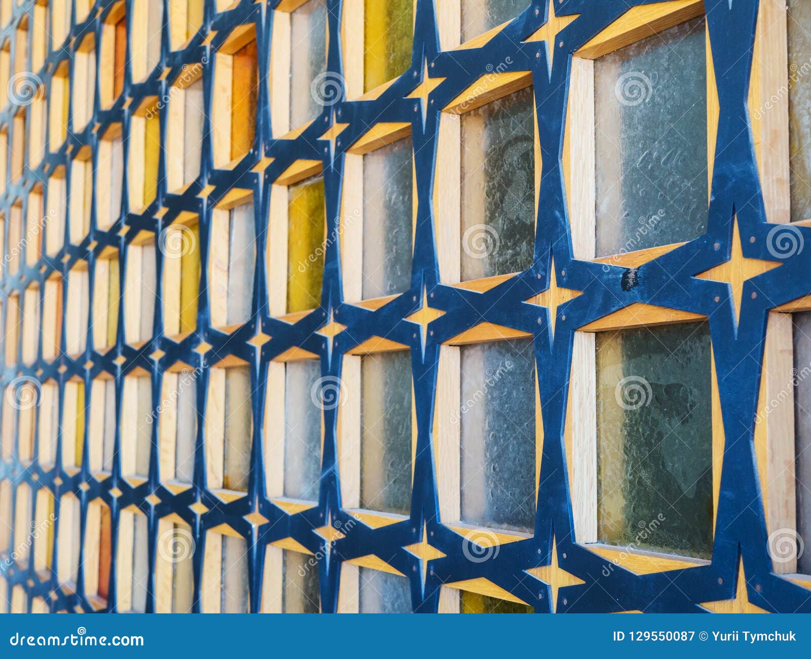 Glass Block Wall with Wood of Blue-yellow Colors. Side View. Wall with ...