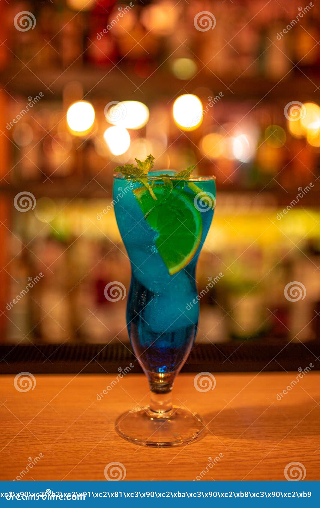 Glass of Blue Lagoon Cocktail on the Table Stock Image - Image of ...