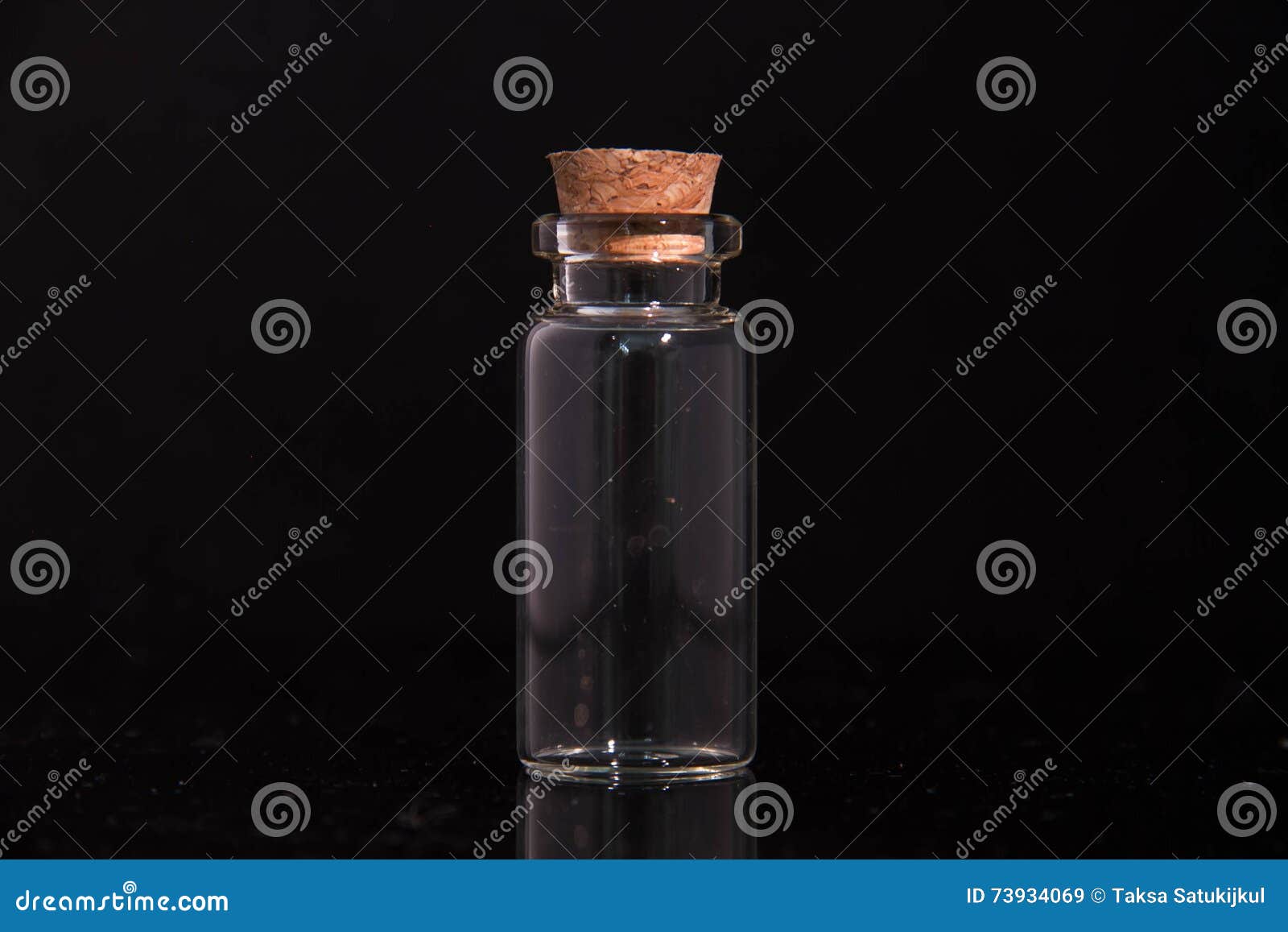 Glass bottle in the dark stock image. Image of object - 73934069