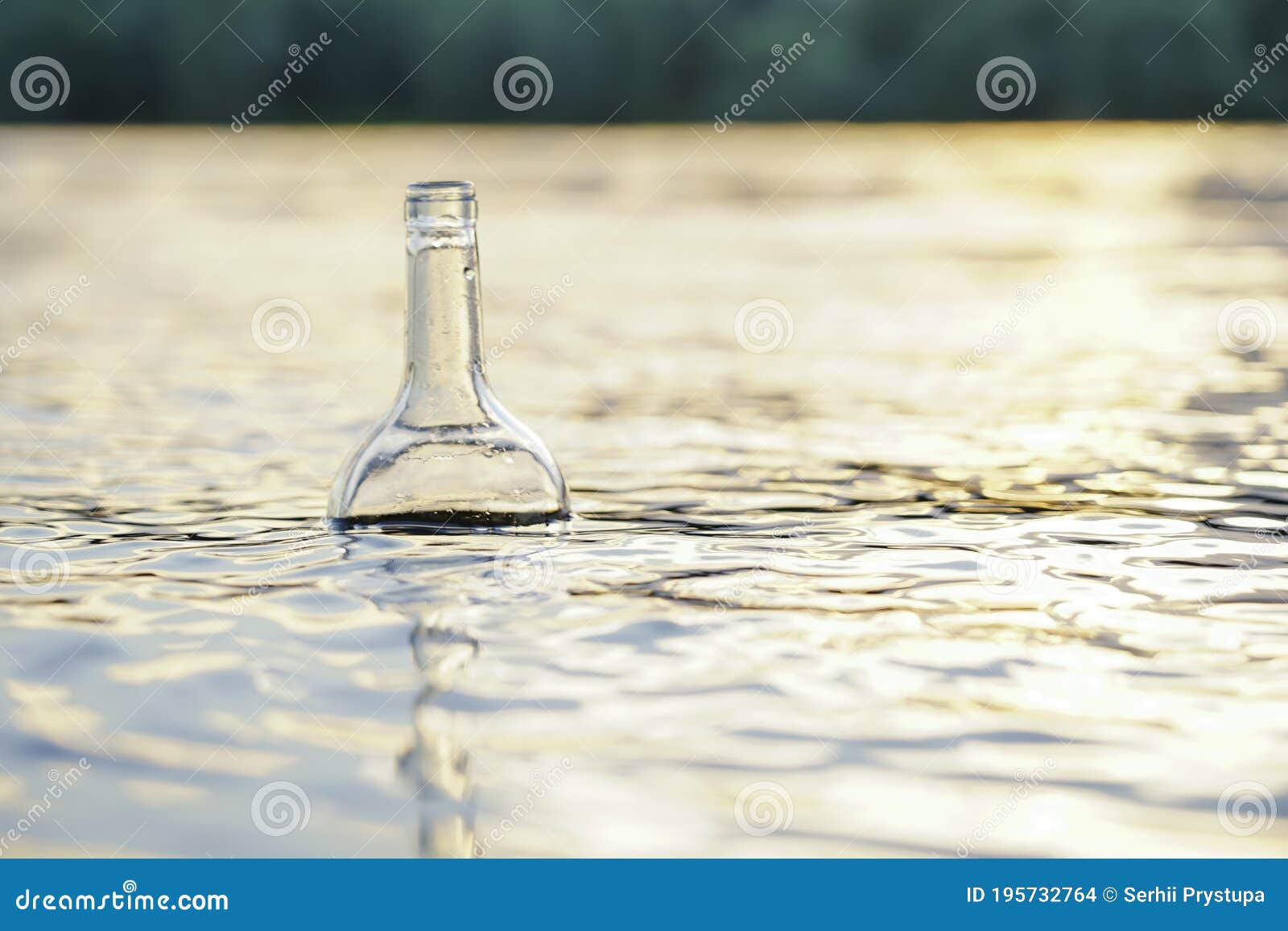 Glass Bottle Floats Adrift in Water Stock Photo - Image of floats ...