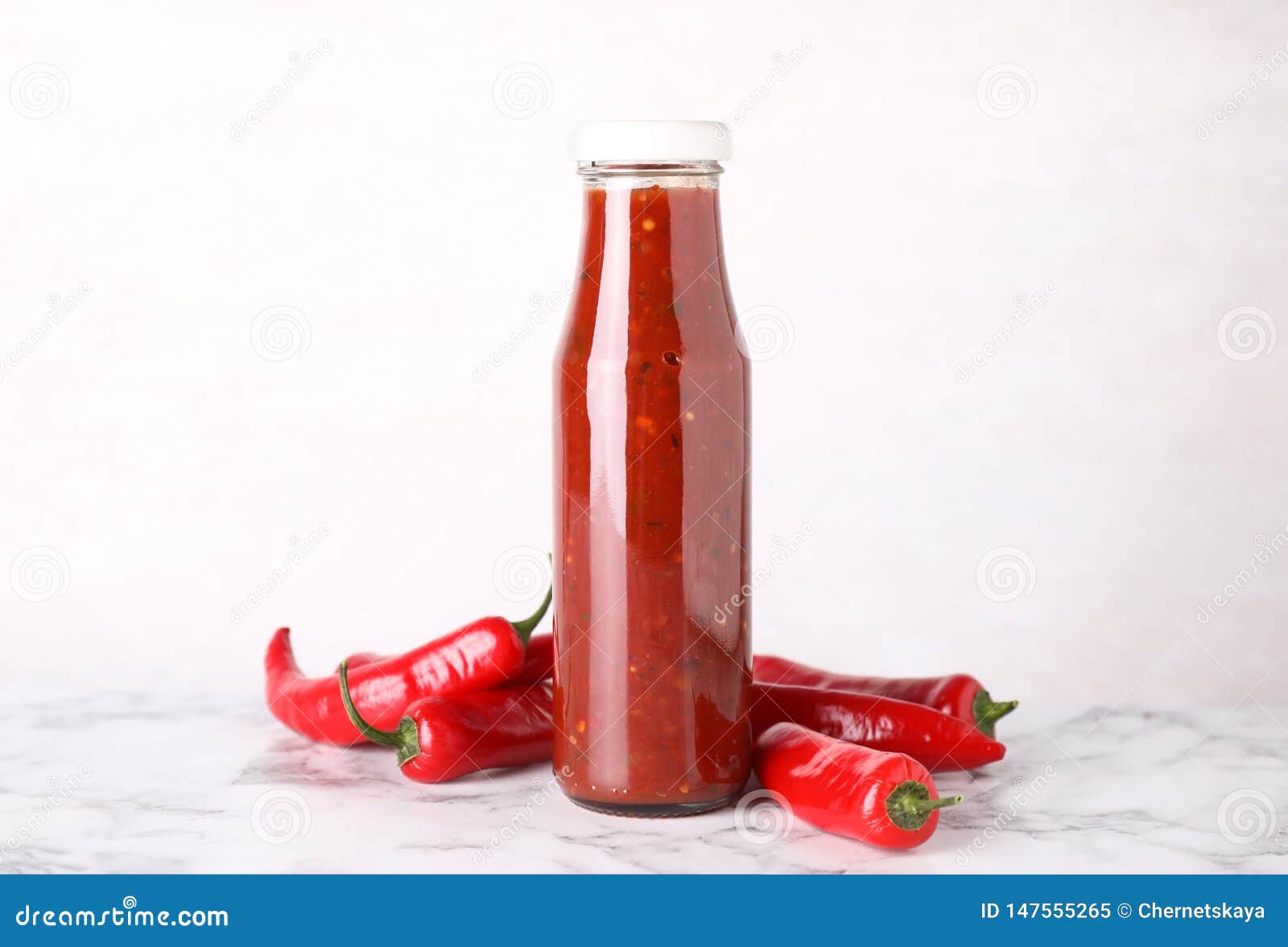 Glass Bottle of Hot Chili Sauce with Peppers Stock Image - Image of ...