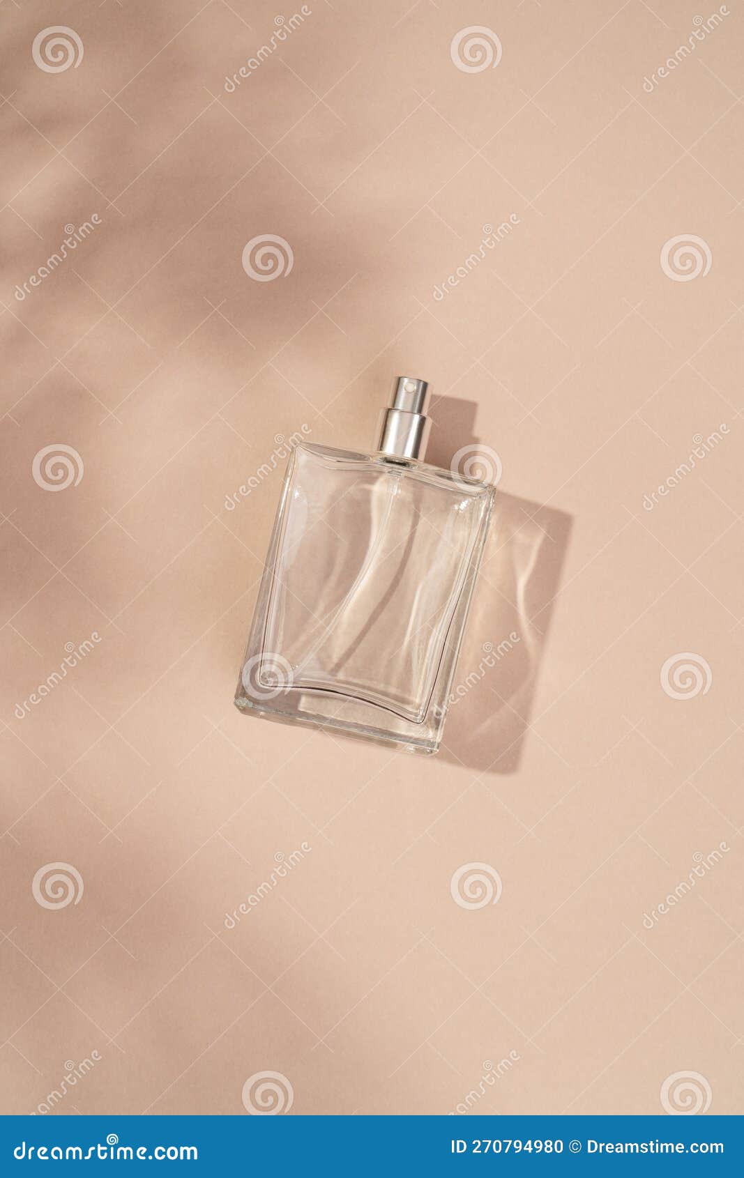 Glass Bottle of Perfume on Beige Background. Fragrance on a Beige Table ...