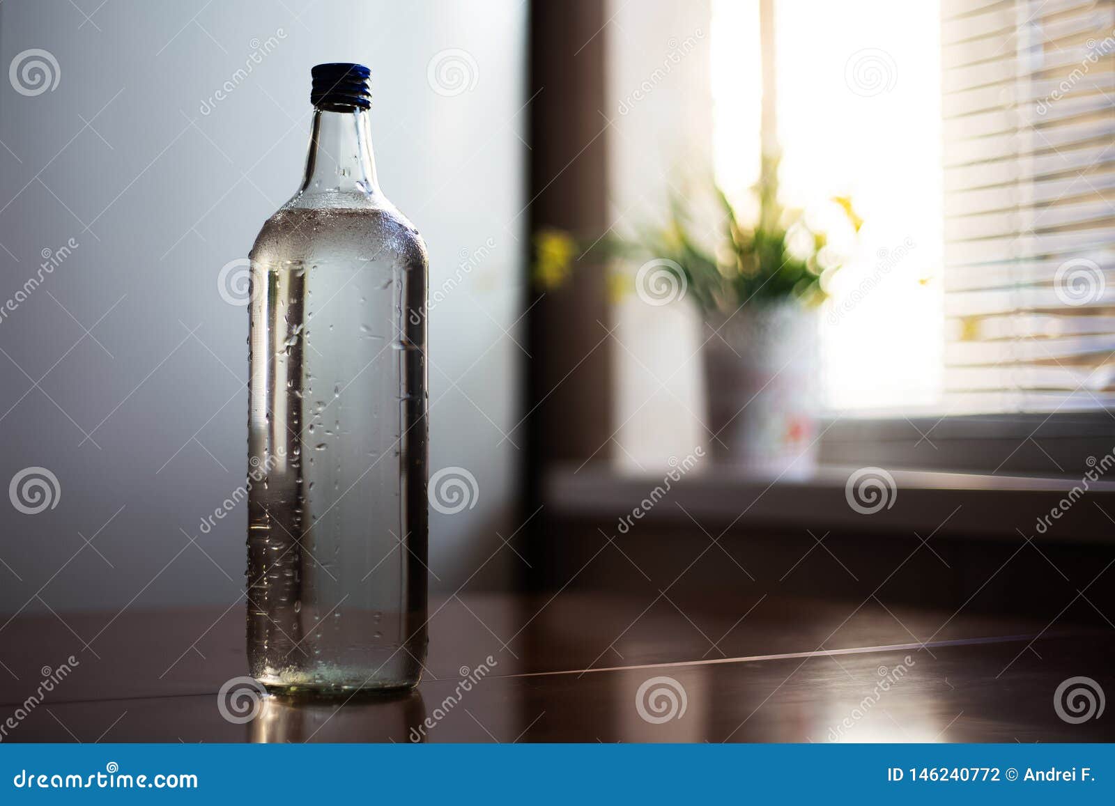 Glass Bottle with Water on the Table Stock Photo - Image of design ...