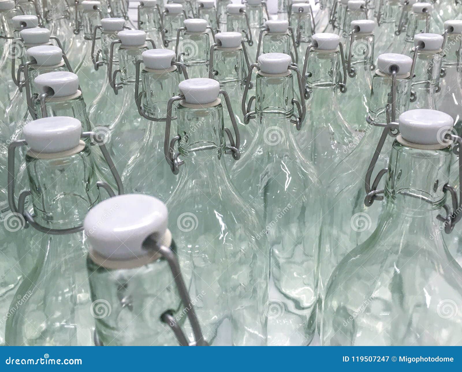 Glass bottles set in rows stock image. Image of indoors - 119507247