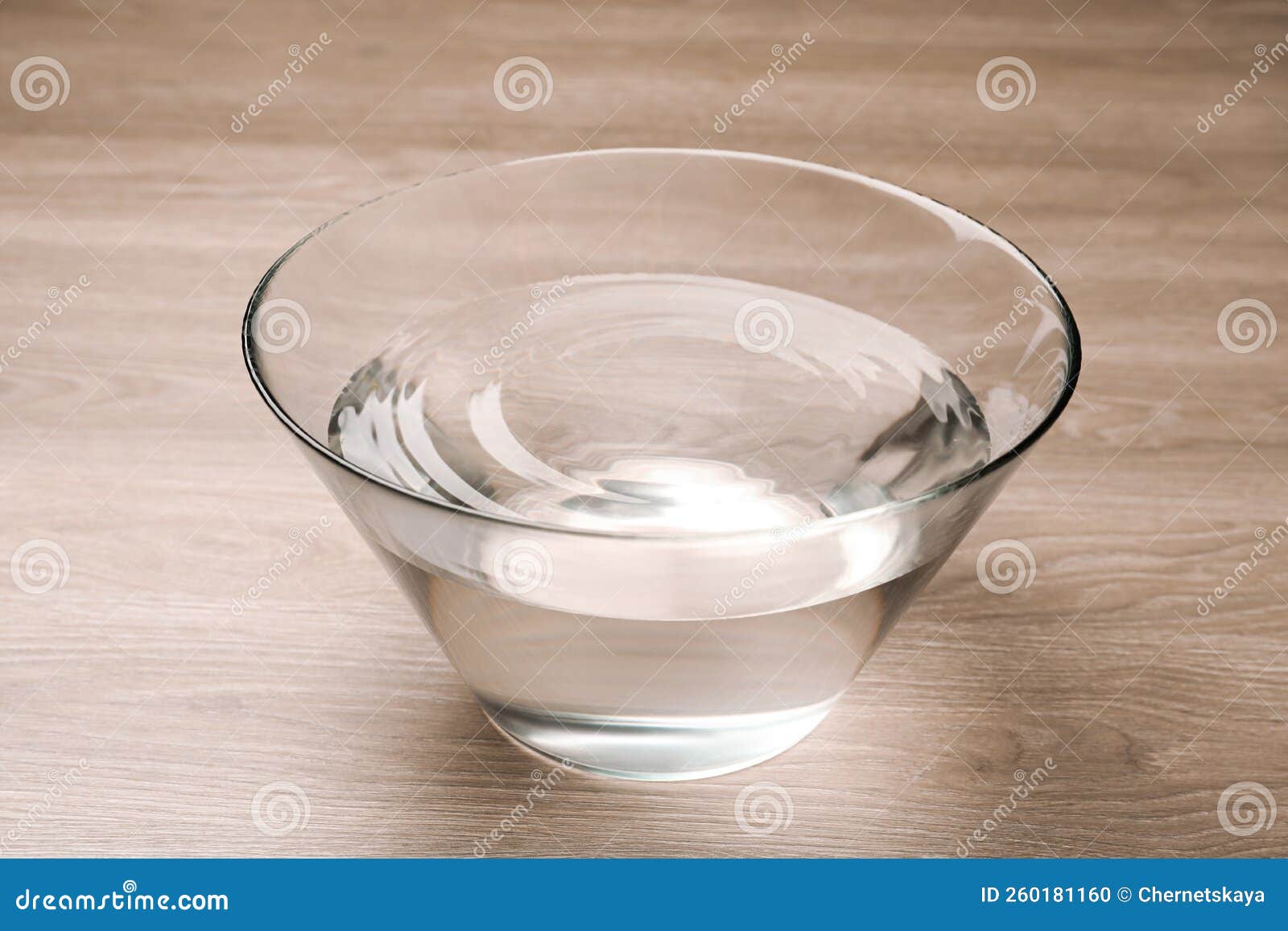 Glass Bowl with Water on Wooden Table Stock Photo - Image of dishware ...