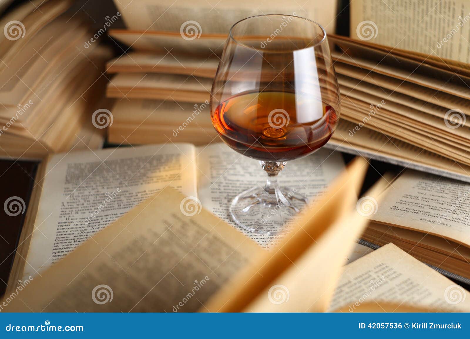 Glass of brandy on books stock photo. Image of classic - 42057536
