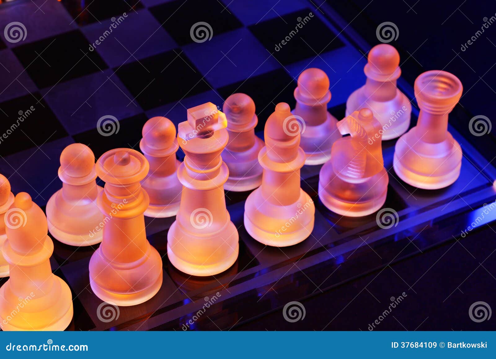 Glass Chess On A Chessboard Lit By Blue And Orange Light Stock Image ...