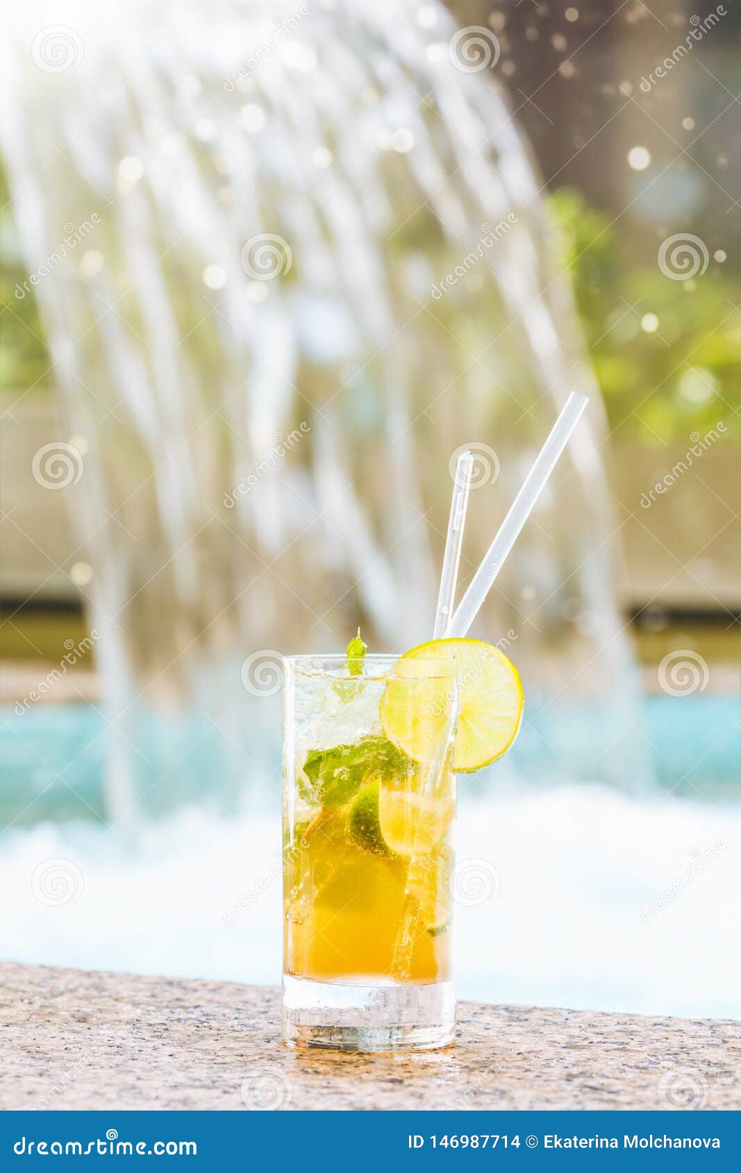 Glass Of Classic Mojito Cocktail With Caipirinha On Stone Edge Of