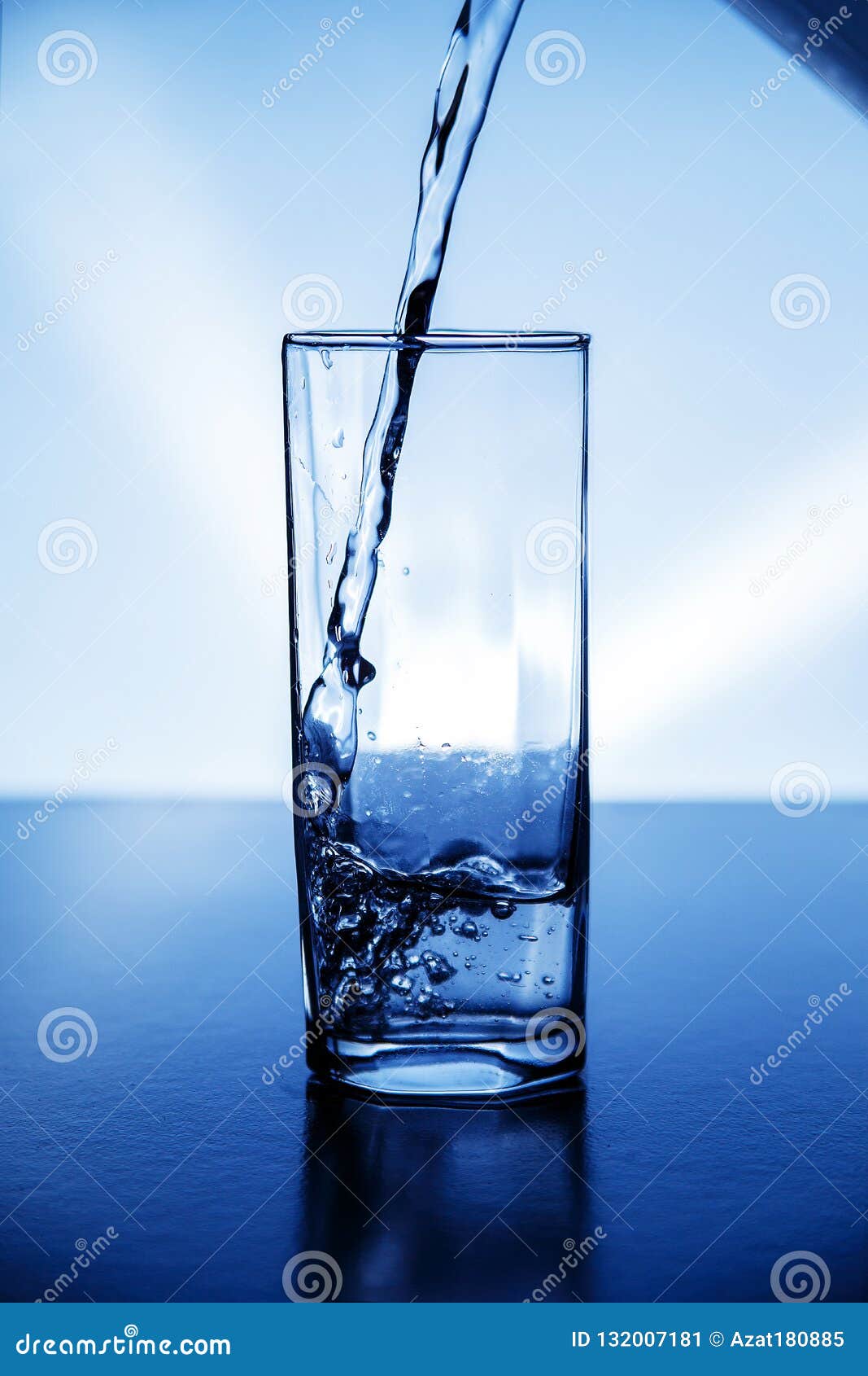 A Glass of Clean Drinking Water Illuminated with Blue Light. Stock ...