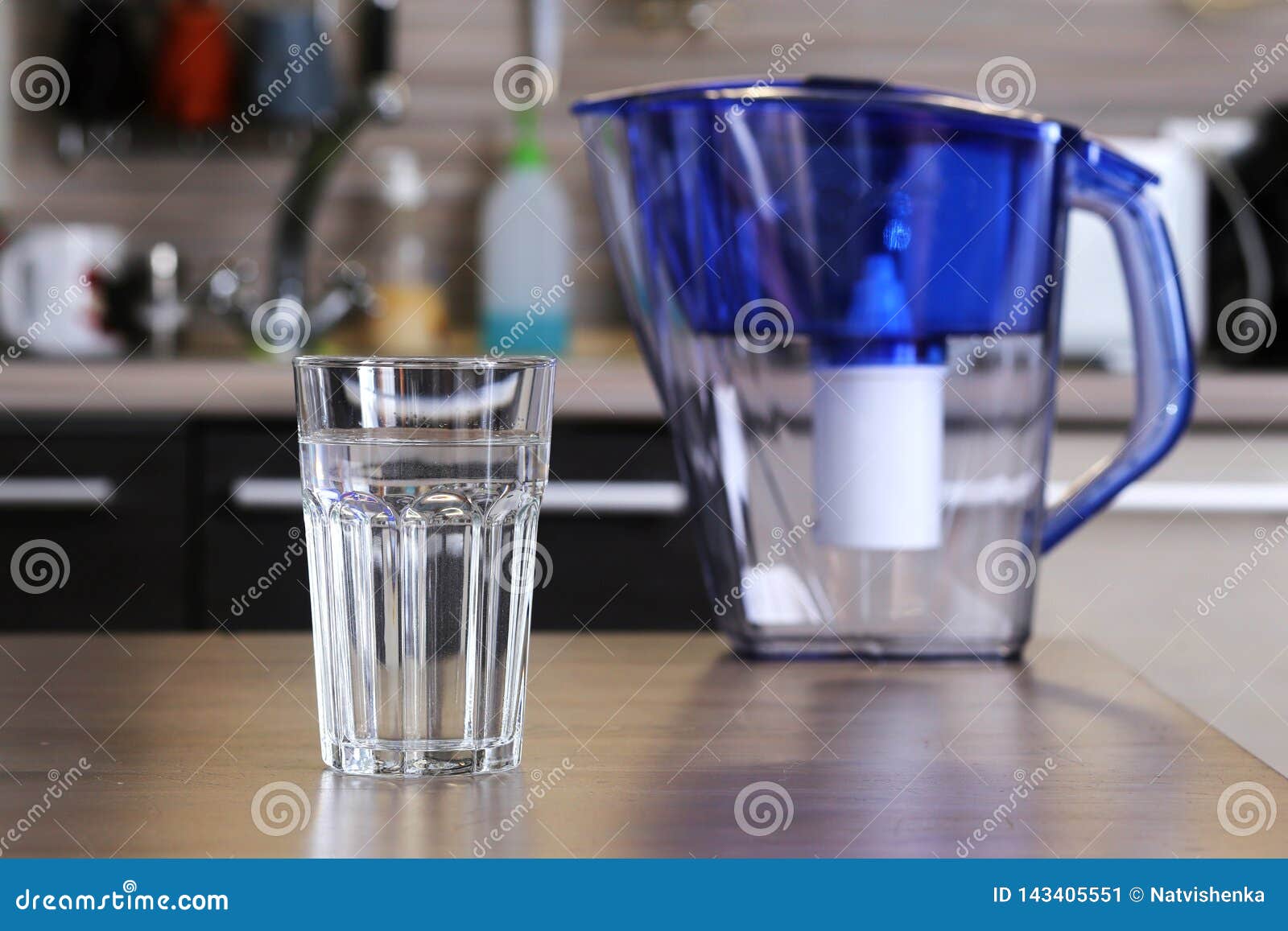 Glass of Clean Water and Filter for Cleaning Drinking Water on the ...