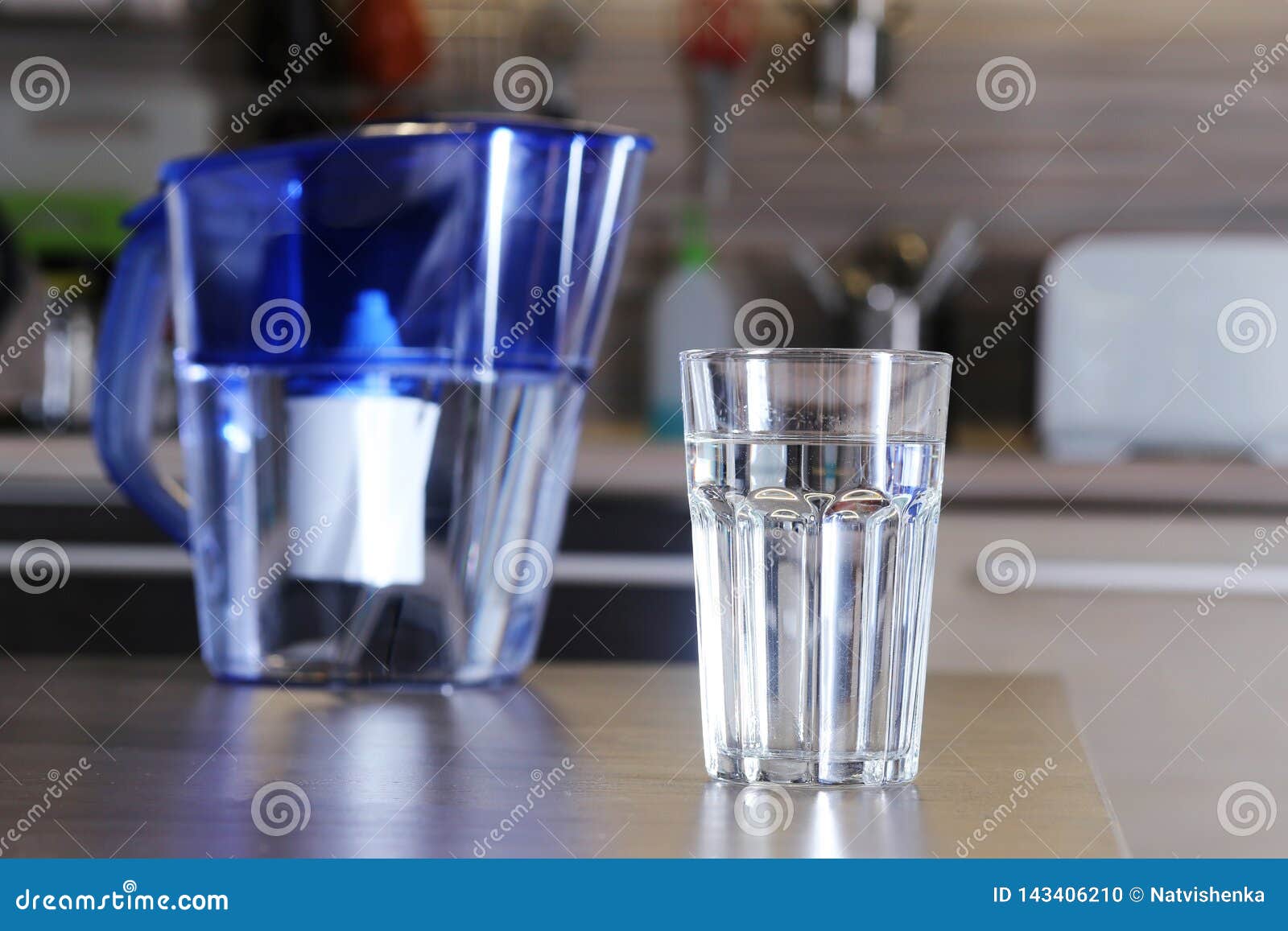Glass of Clean Water and Filter for Cleaning Drinking Water on the ...