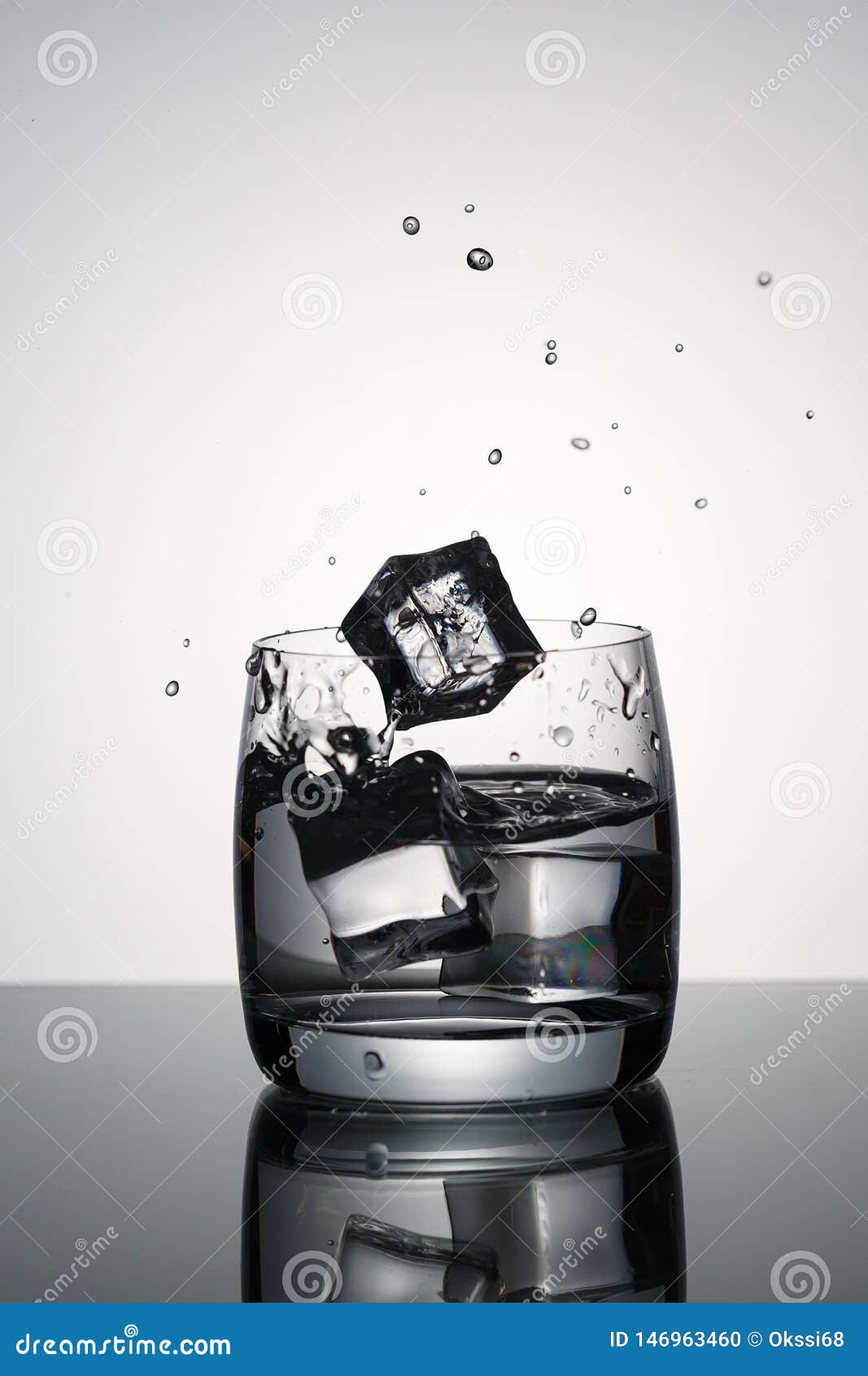 Glass of Clean Water with Ice Stock Photo - Image of splashing ...