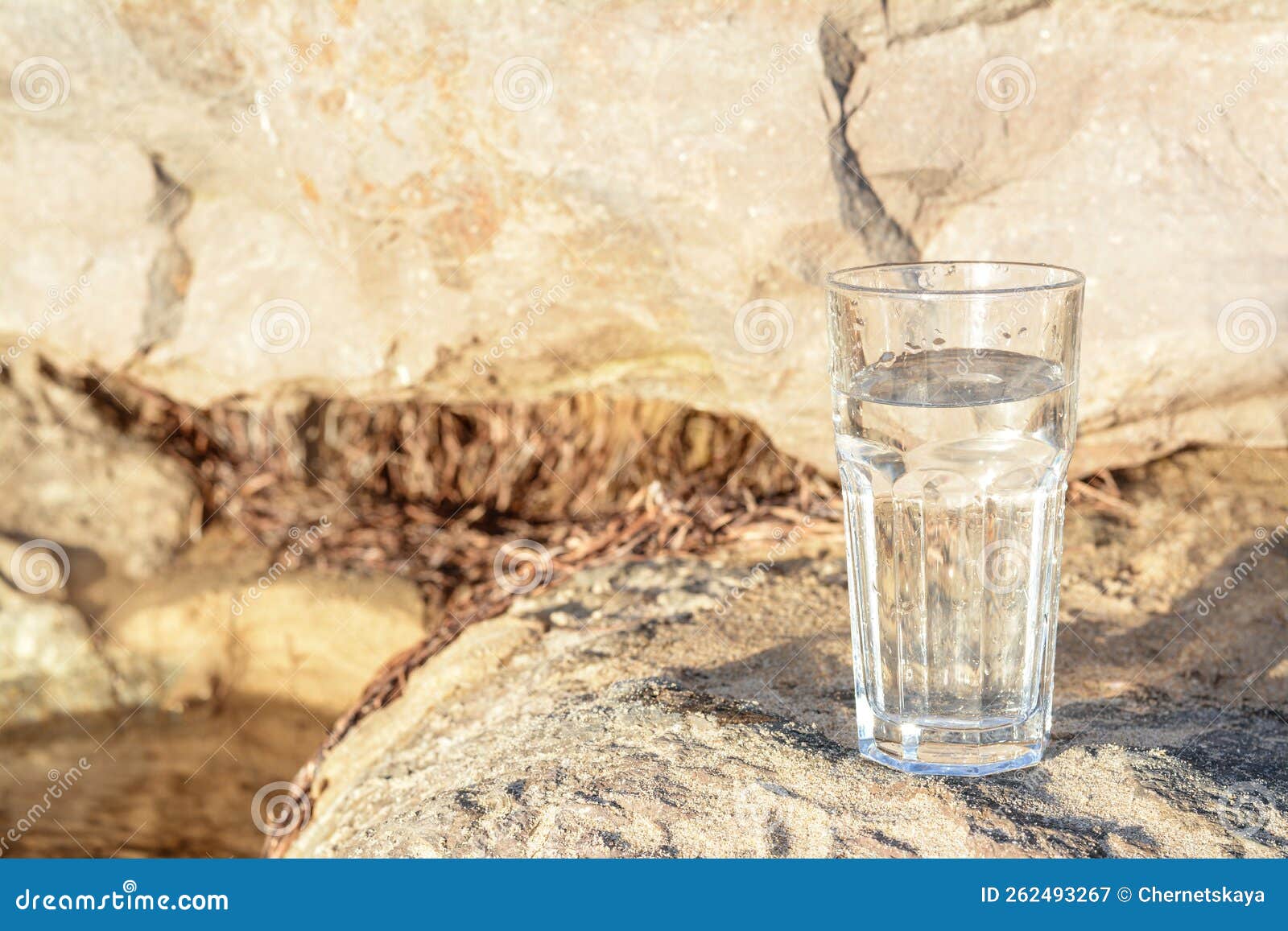 Glass of Clean Water on Rock Outdoors. Space for Text Stock Image ...