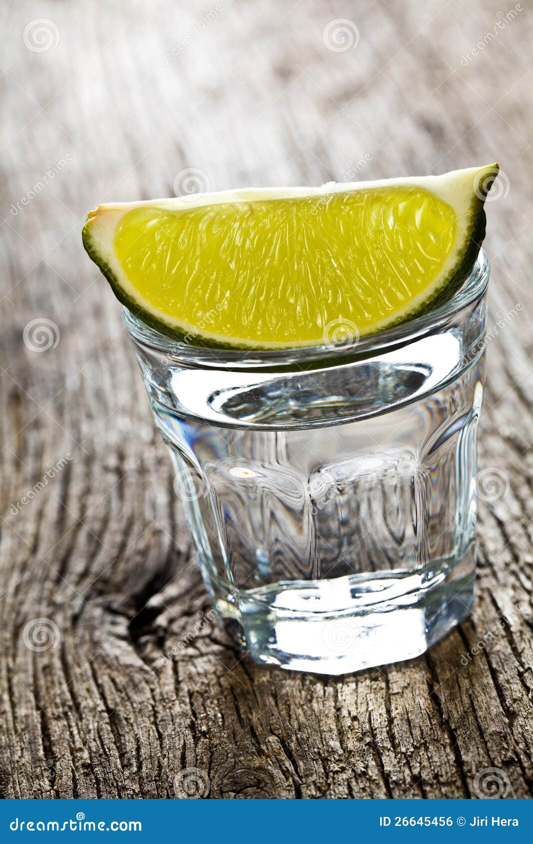 Glass of clear alcohol stock photo. Image of beverage - 26645456
