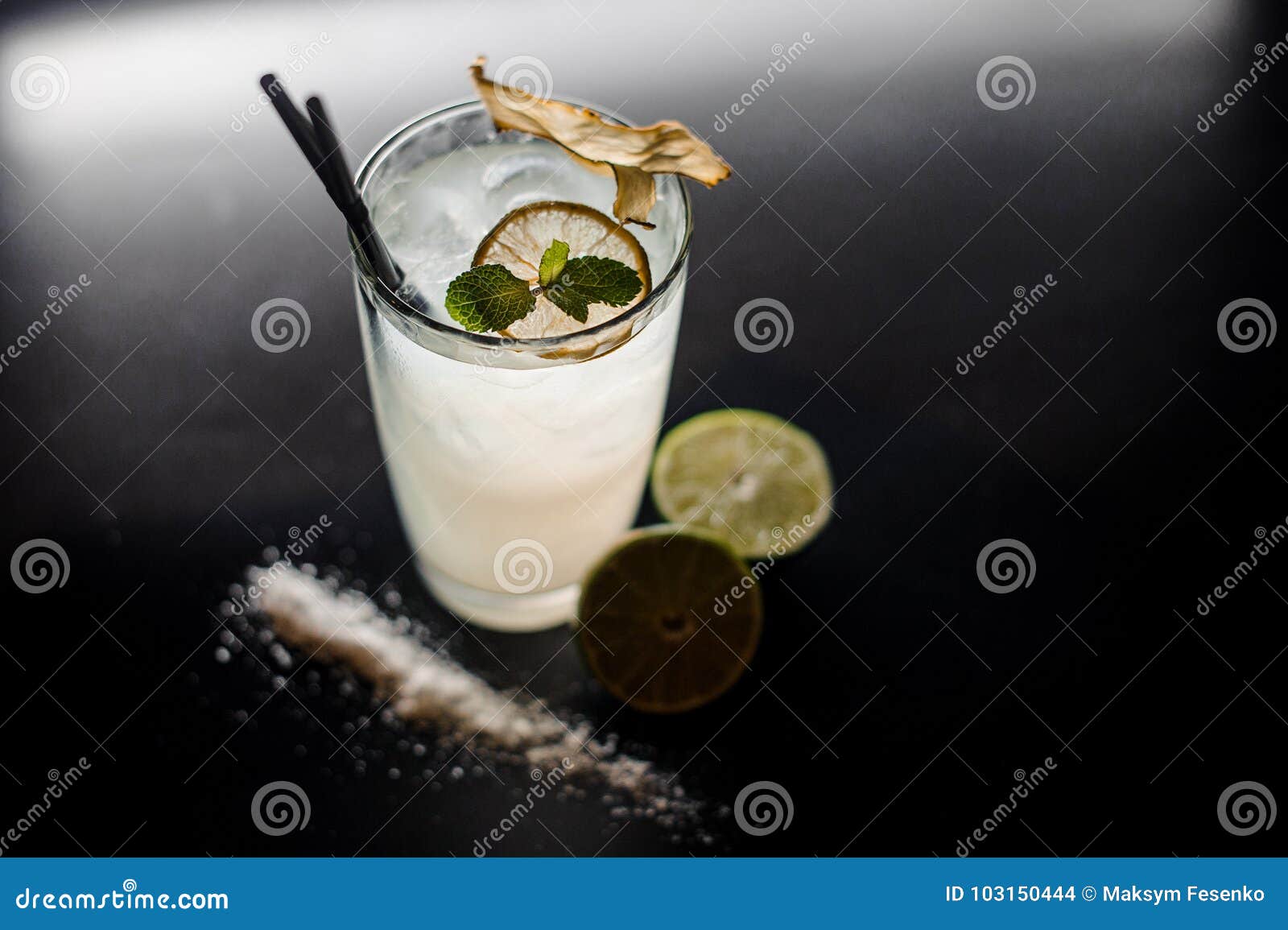 Glass of Clear Alcoholic Cocktail Decorated with a Slice of Lime Stock ...