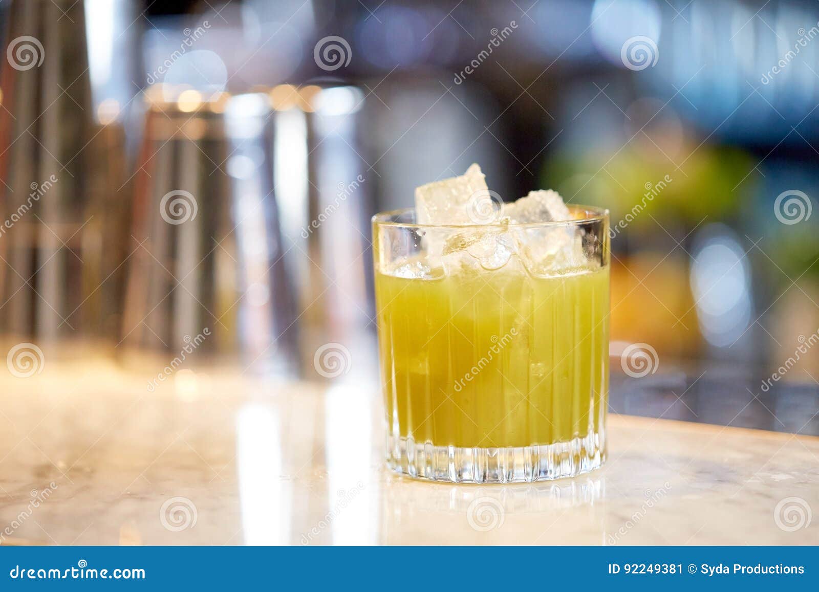 Glass of Cocktail with Ice Cubes at Bar Stock Image - Image of ...
