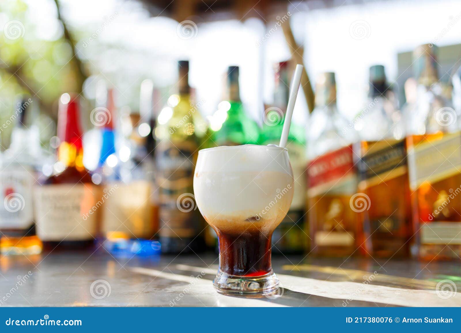 A glass of coffee at bar stock photo. Image of table - 217380076