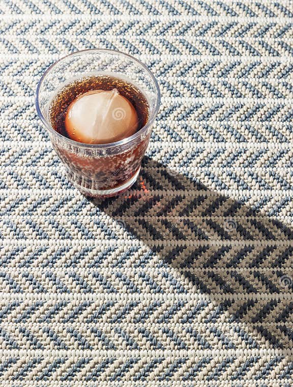 A Glass of Coke Put on a Graphic Map and Lighting Compose with a Shadow ...