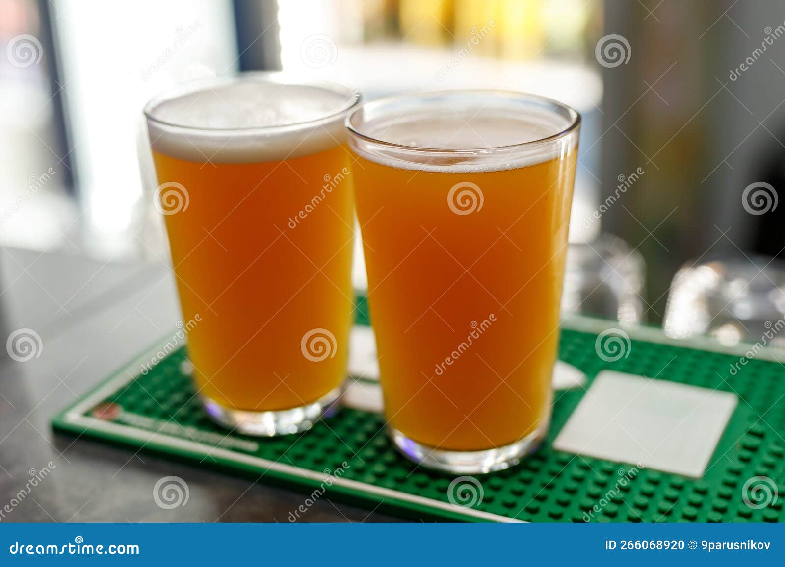 A Glass of Cold Beer at Bar Counter. Stock Photo - Image of foam ...