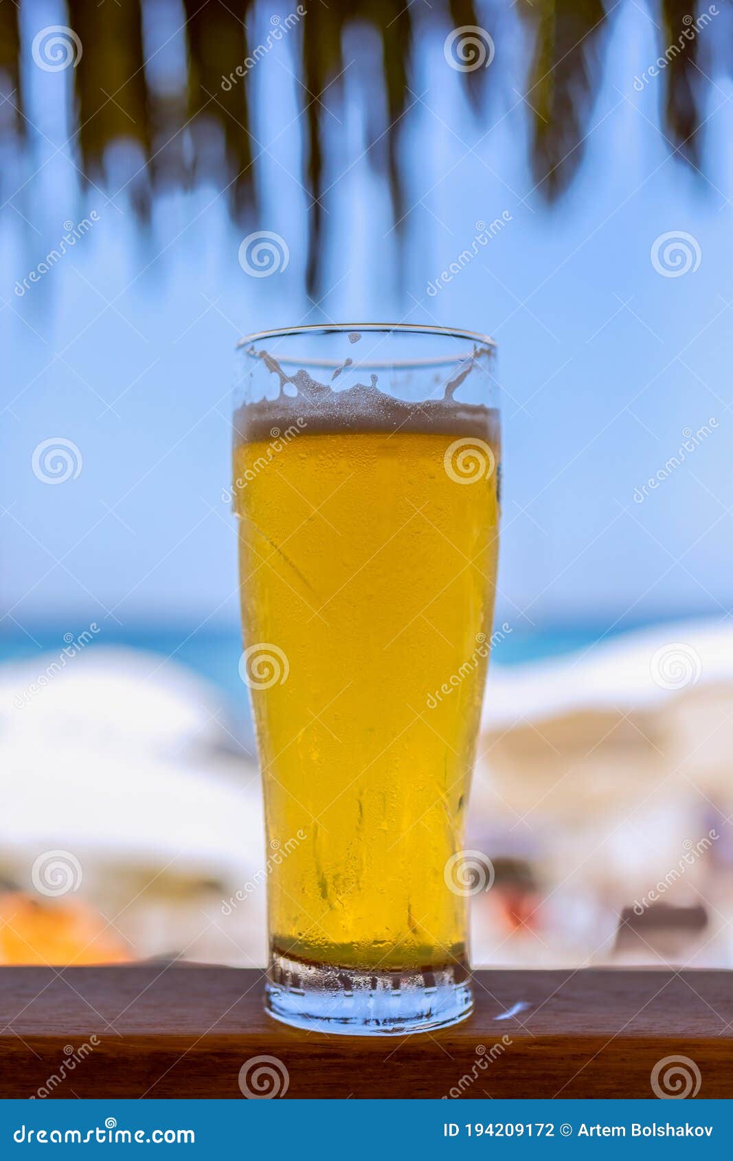 Glass of Cold Beer at a Beach Bar Stock Photo - Image of condensation ...