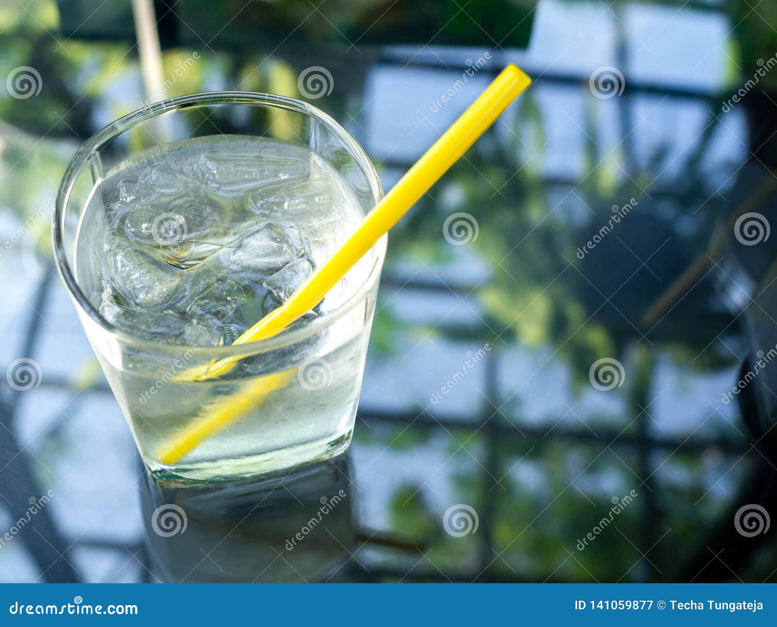 A Glass of Cold Drinking Water with Yellow Straw Stock Image - Image of ...