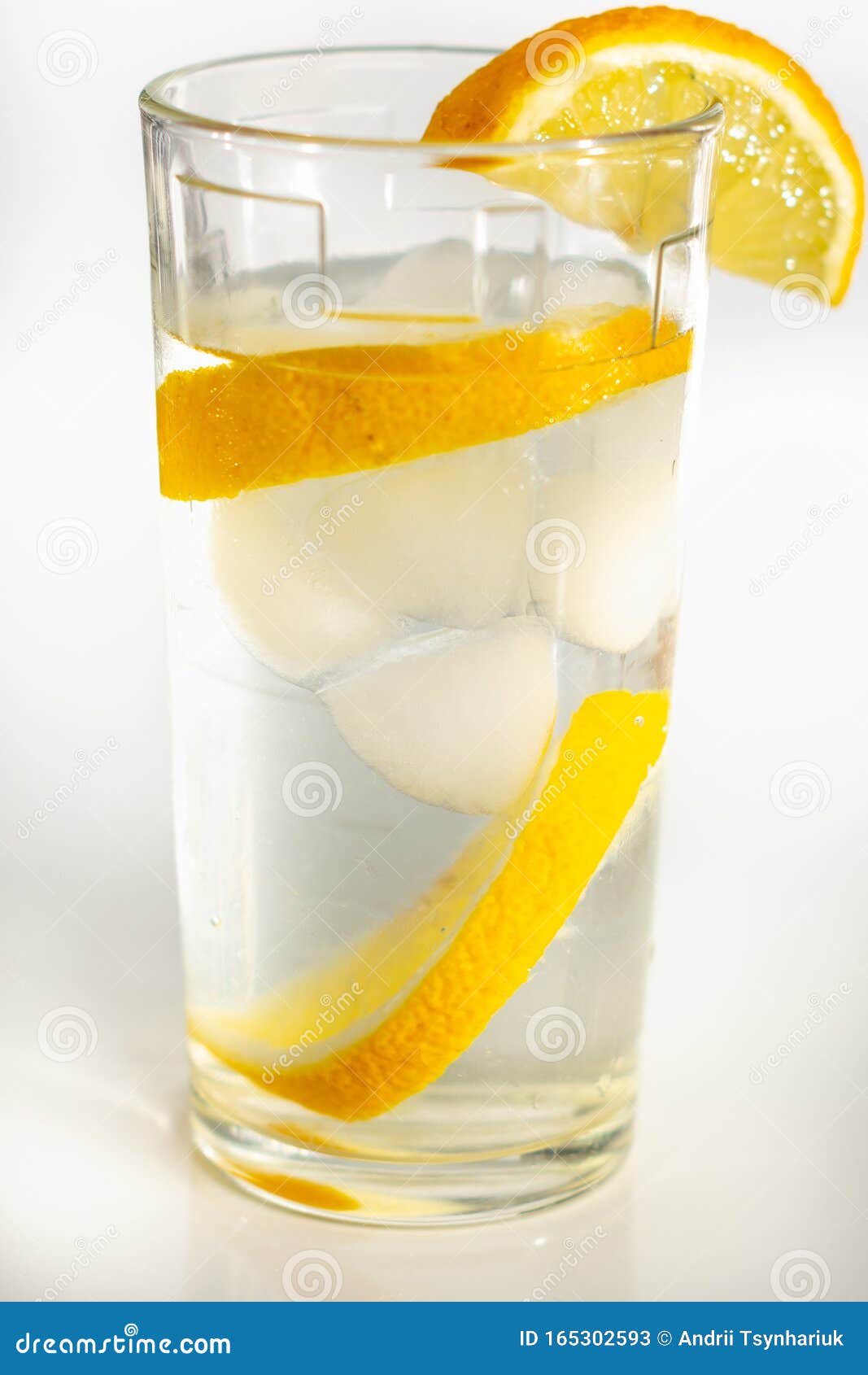 Glass of Cold Fresh Water with Slices of Ice and Lemon Stock Image ...