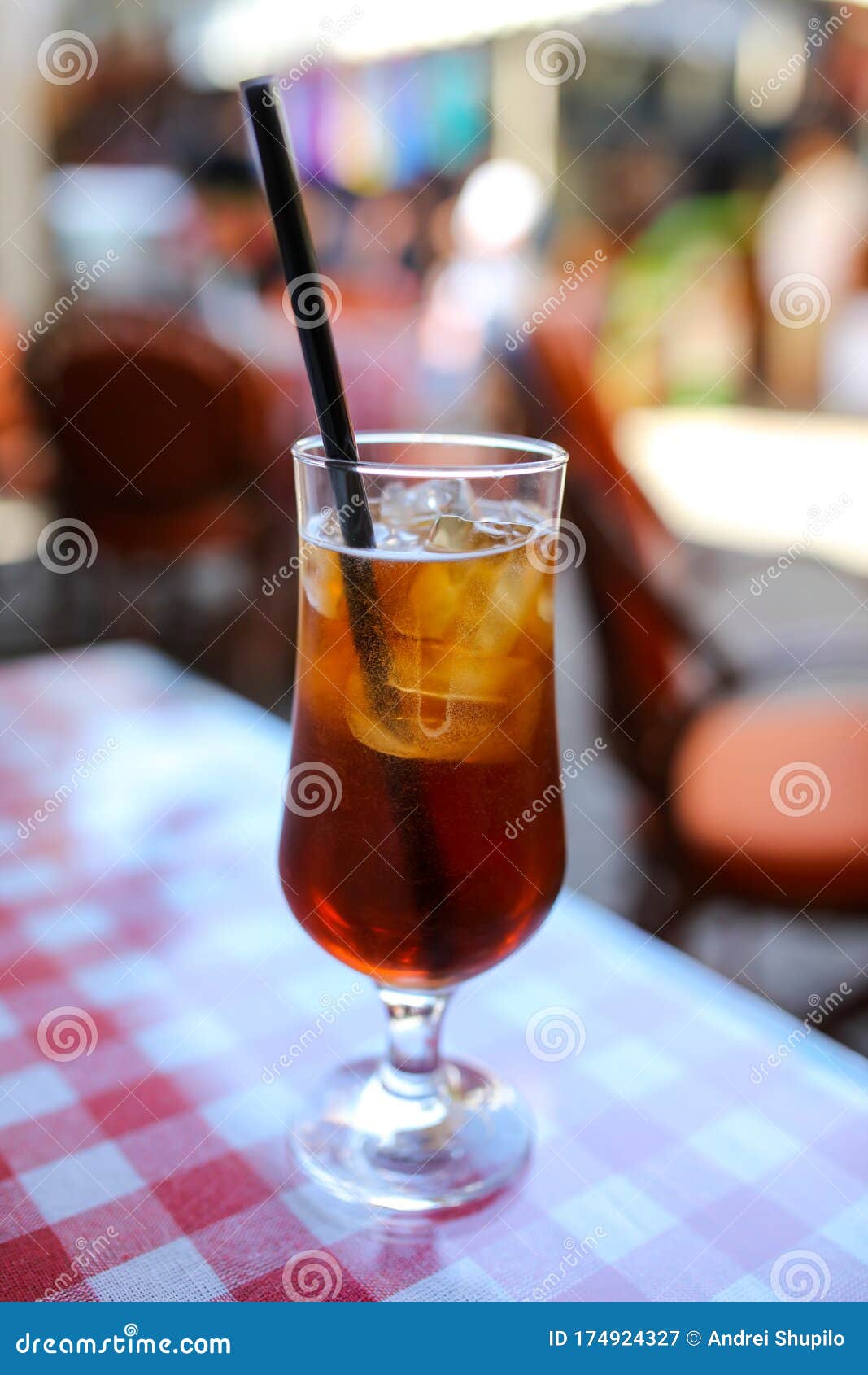 A Glass of Cold Juice with Ice on a Table in a Cafe Stock Image - Image ...