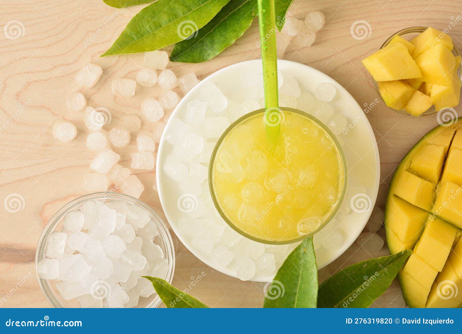 Glass with Cold Mango Drink on Plate with Ice Stock Photo - Image of ...