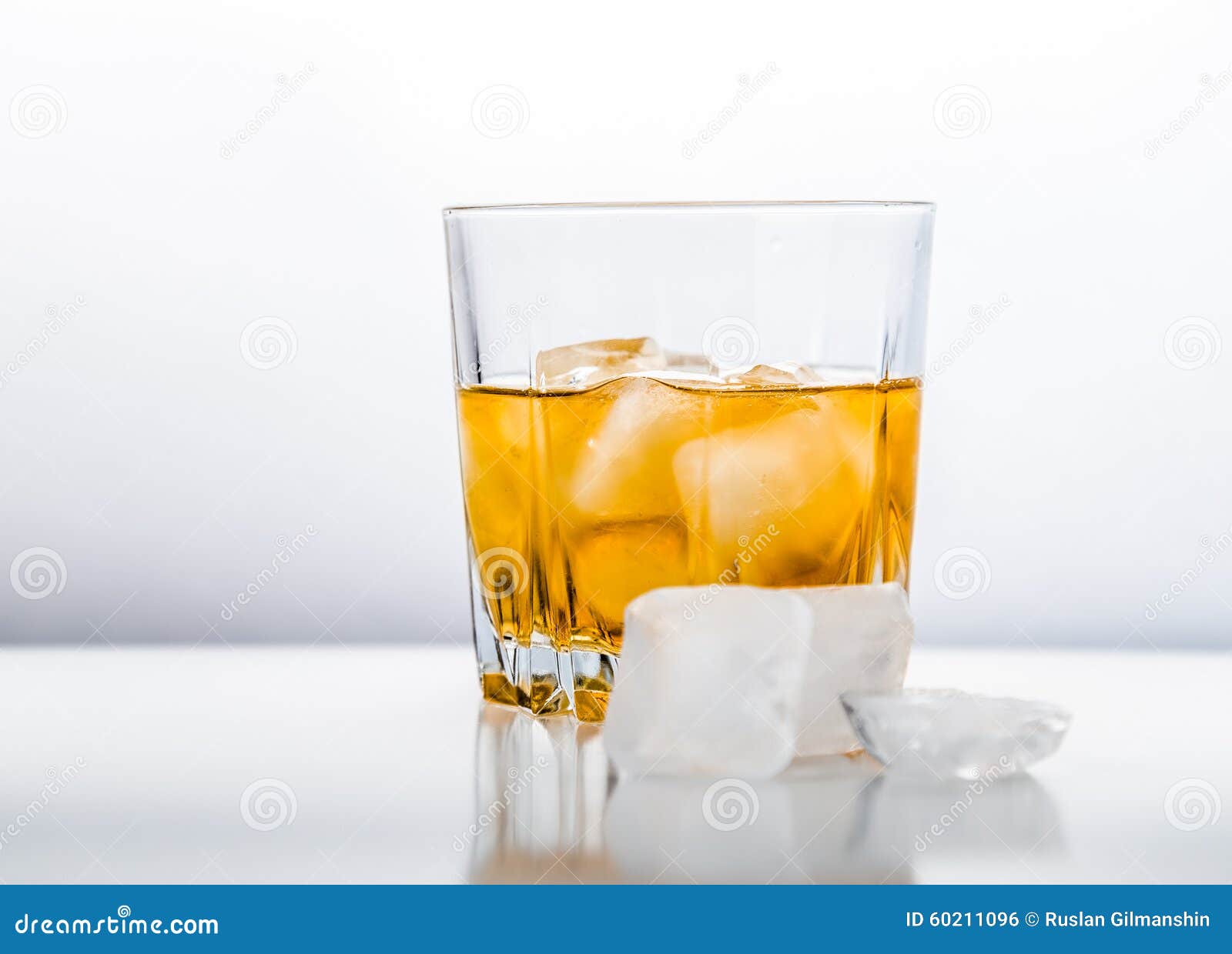 Glass of Cold Whiskey on White Surface Stock Photo - Image of alcohol ...