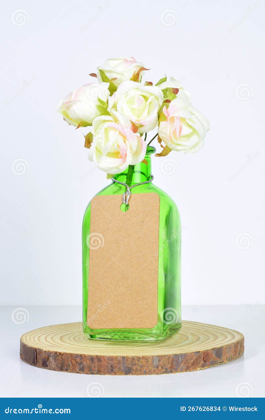 Glass Container with a Small Bouquet of Fabric Roses Stock Photo ...
