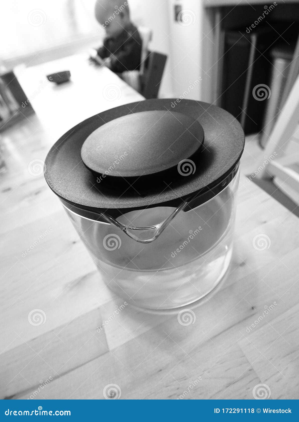 Glass Container with Water Inside Having a Black Cap on Stock Photo ...