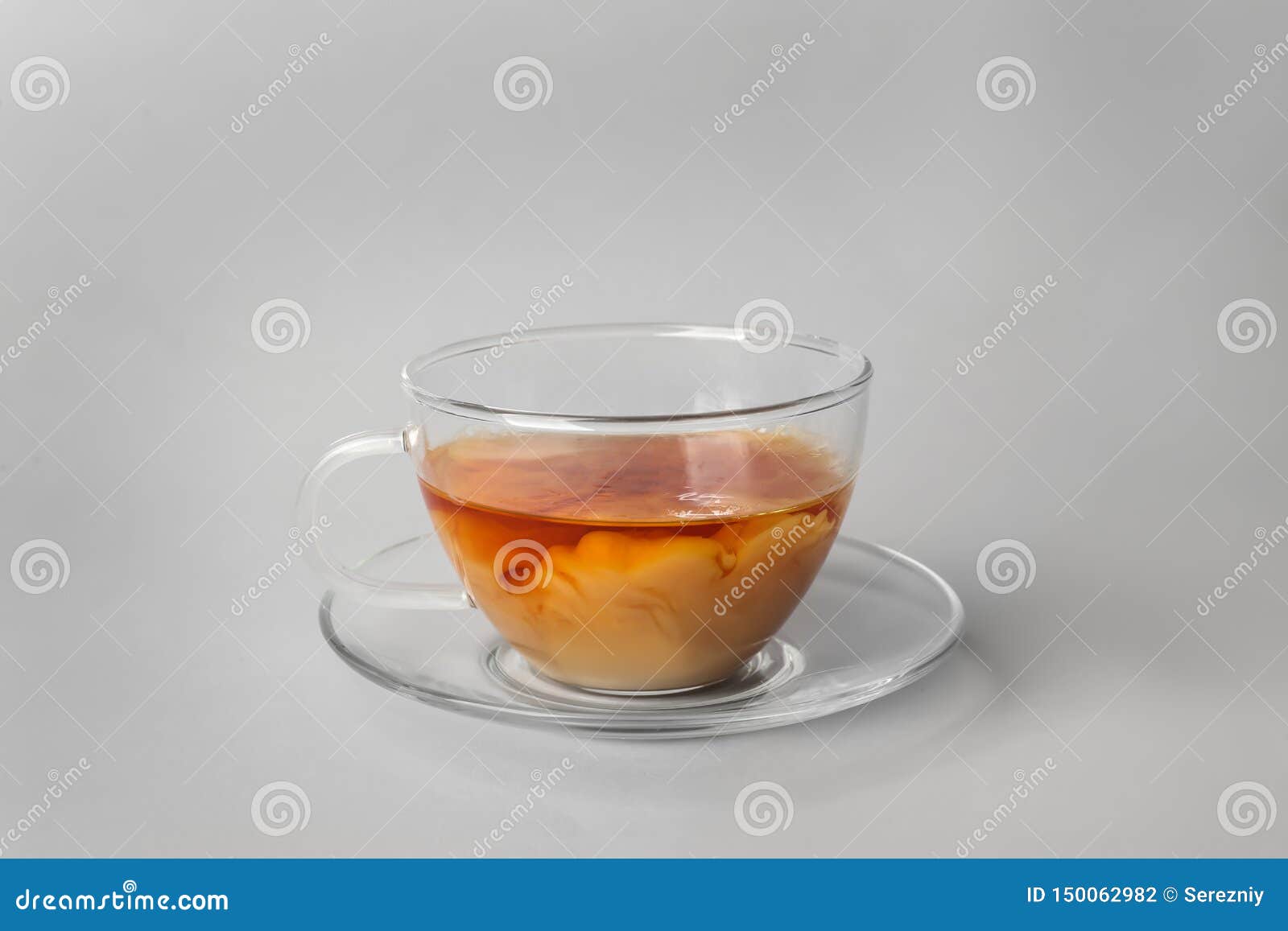 Glass Cup of Aromatic Tea with Milk on Light Background Stock Photo ...