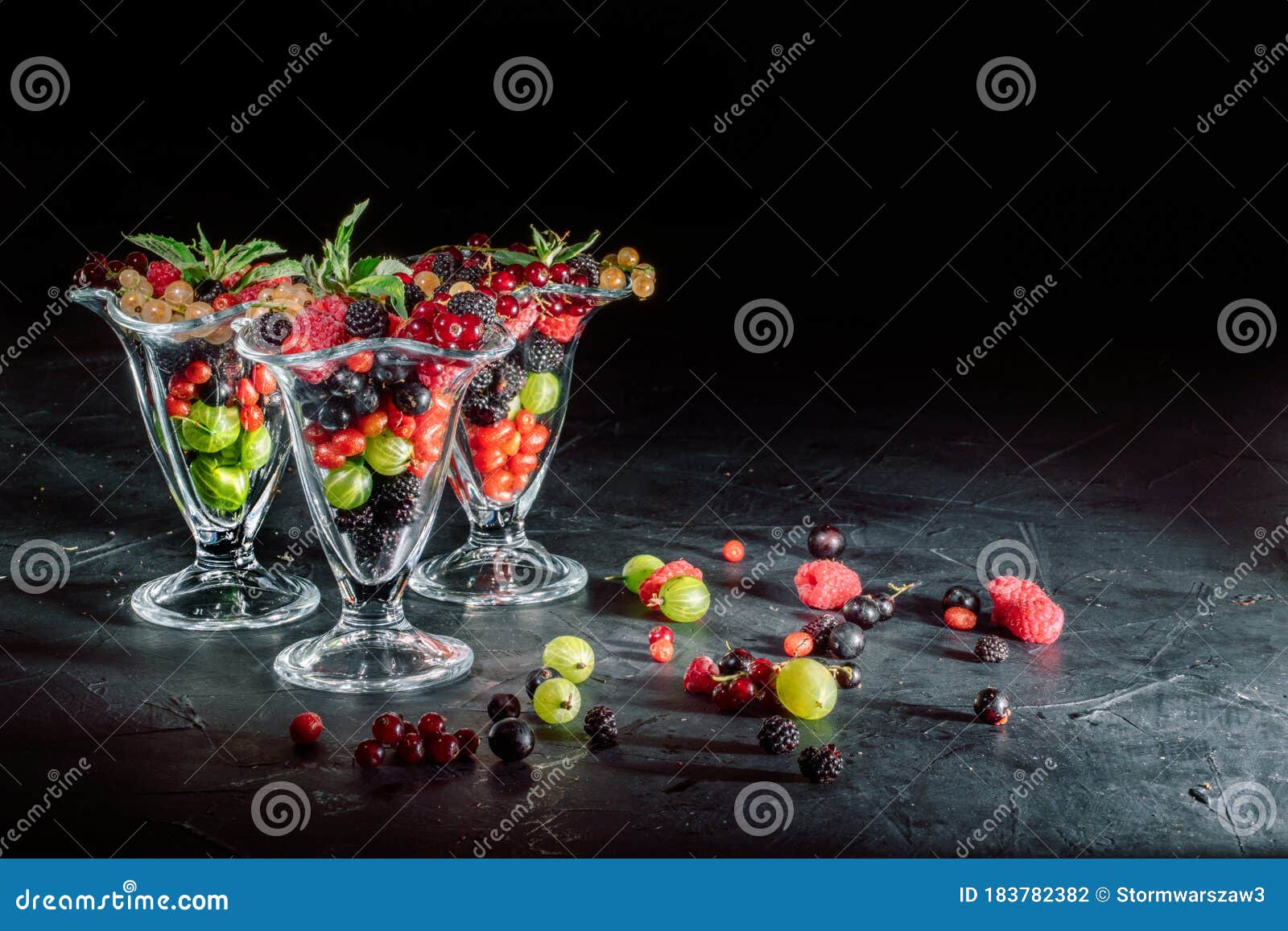 A Glass Cup on a Table Filled with Fresh Different Berries Stock Photo ...
