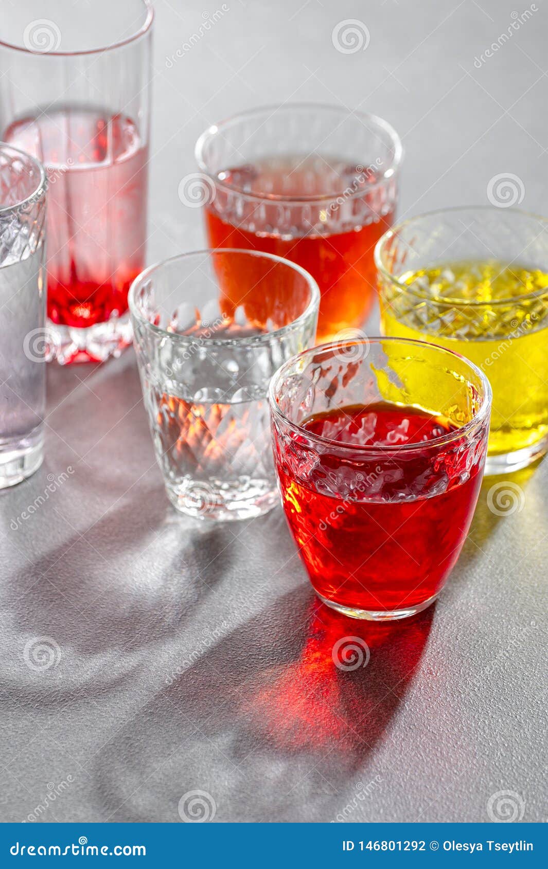 Glass Cups with Colorful Cold Drinks on a Gray Stone Table. Shooting ...
