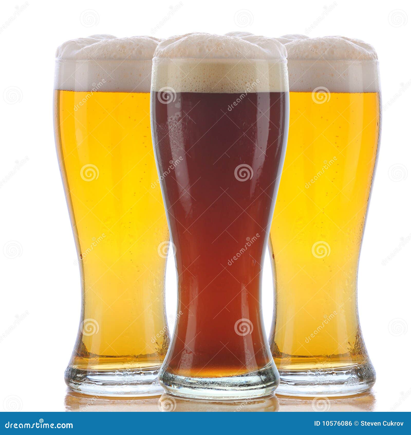 Glass of Dark Ale and Two Pale Ales Stock Photo - Image of drink ...
