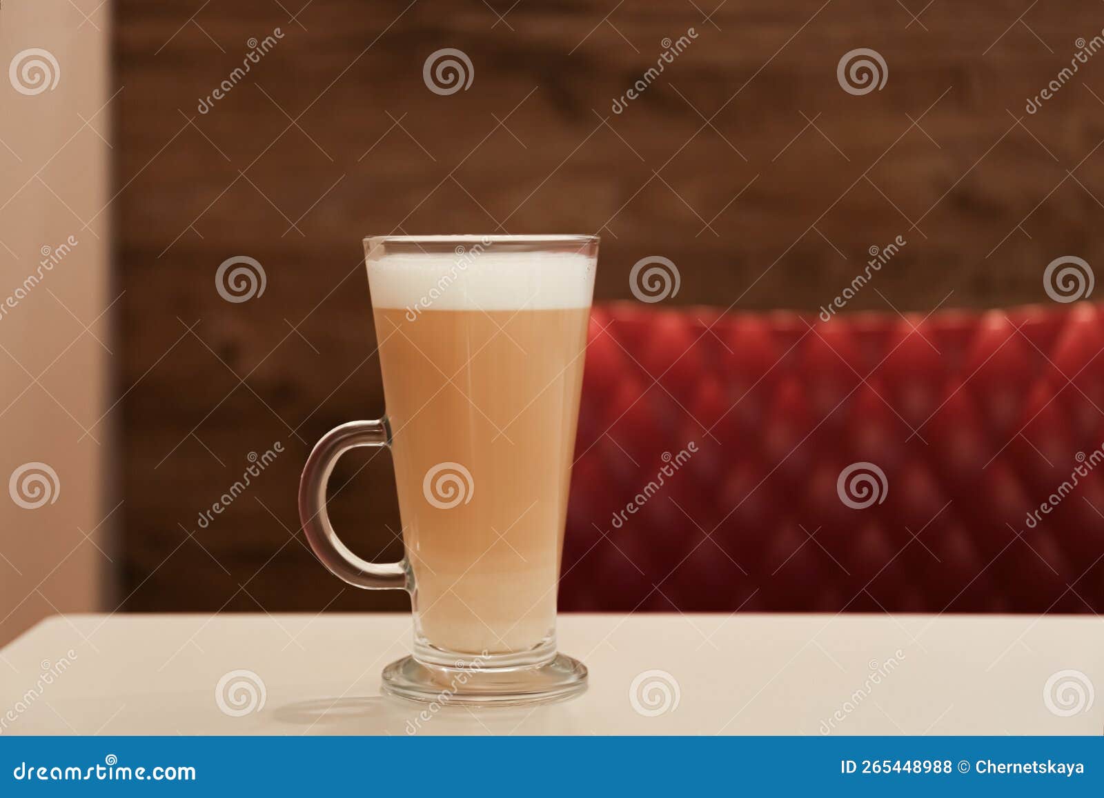 Glass with Delicious Coffee on Beige Table in Cafe. Space for Text ...