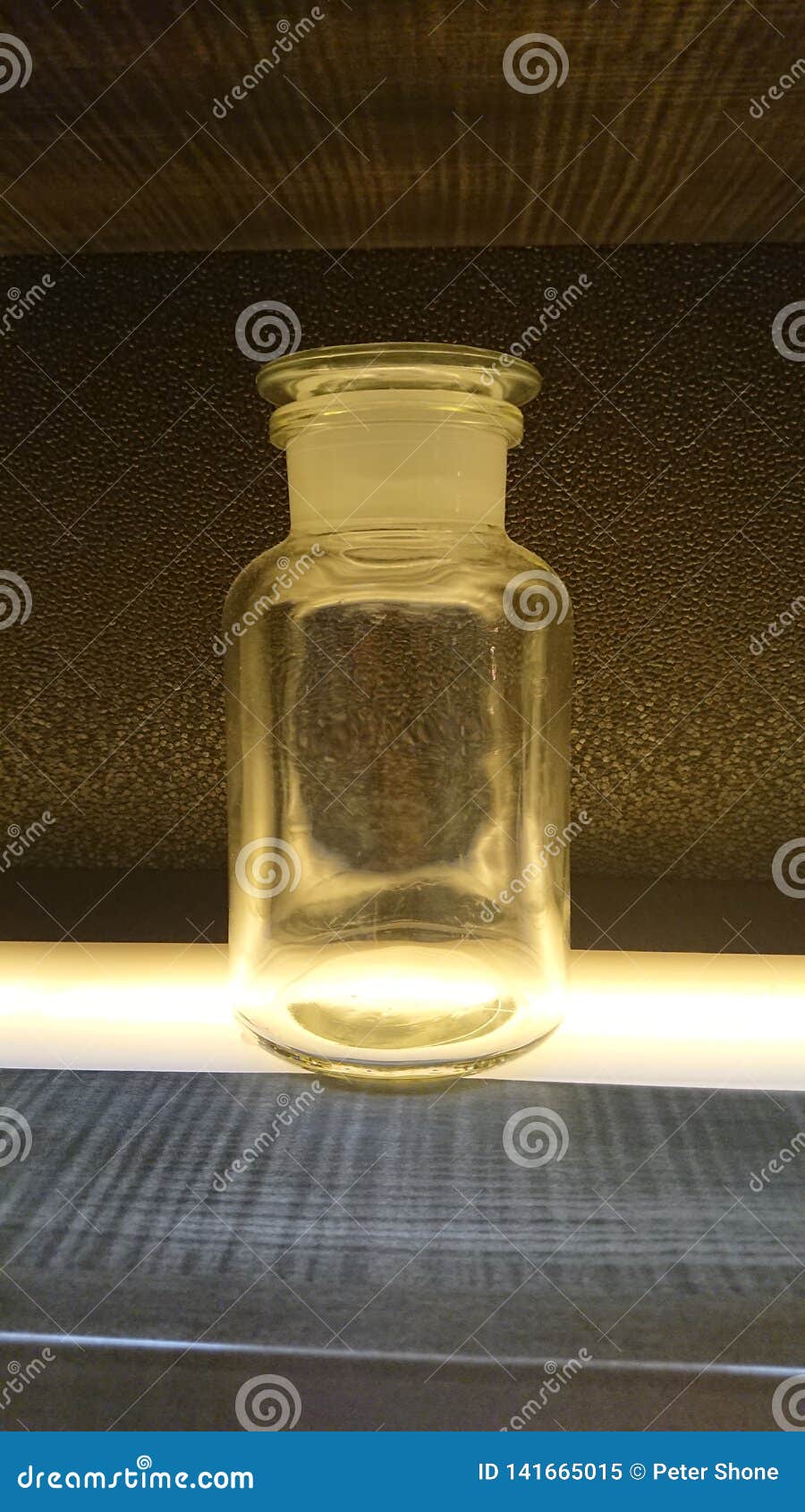 Glass drug bottle on shelf stock image. Image of glass - 141665015