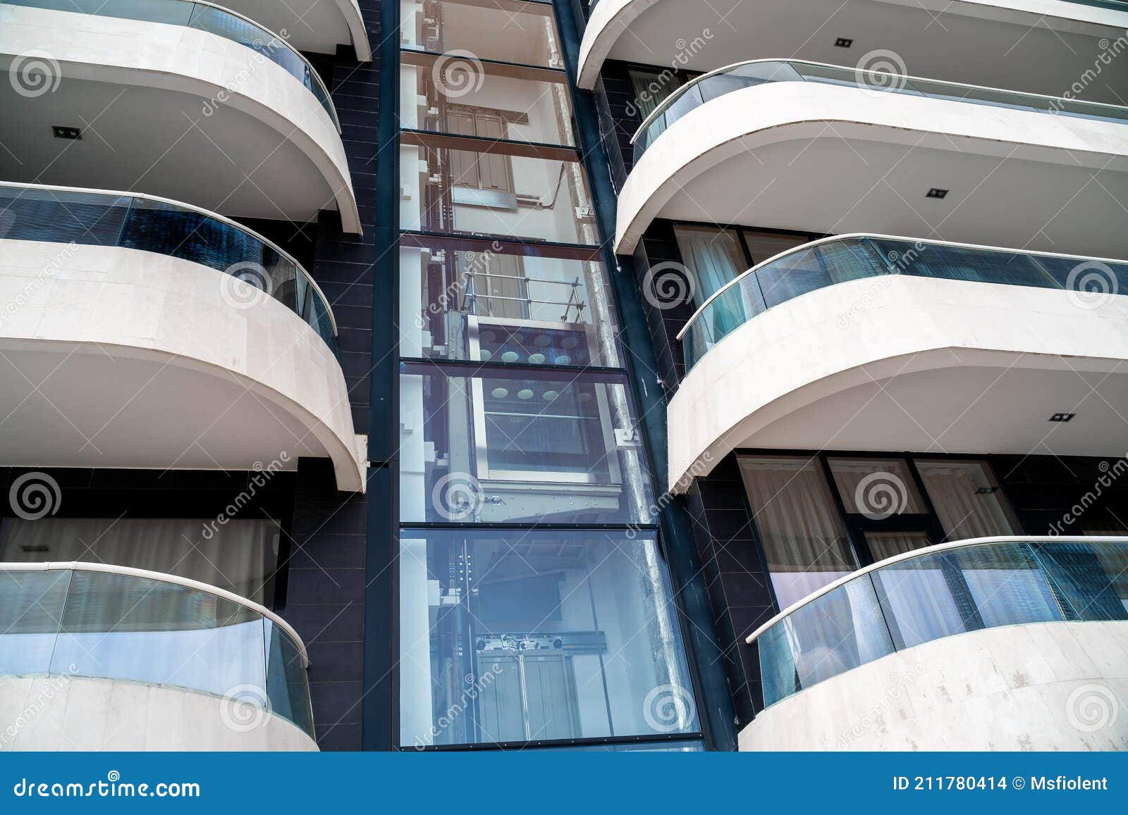 Glass Elevator in a Modern House, Hotel. the Elevator Rises between Two ...