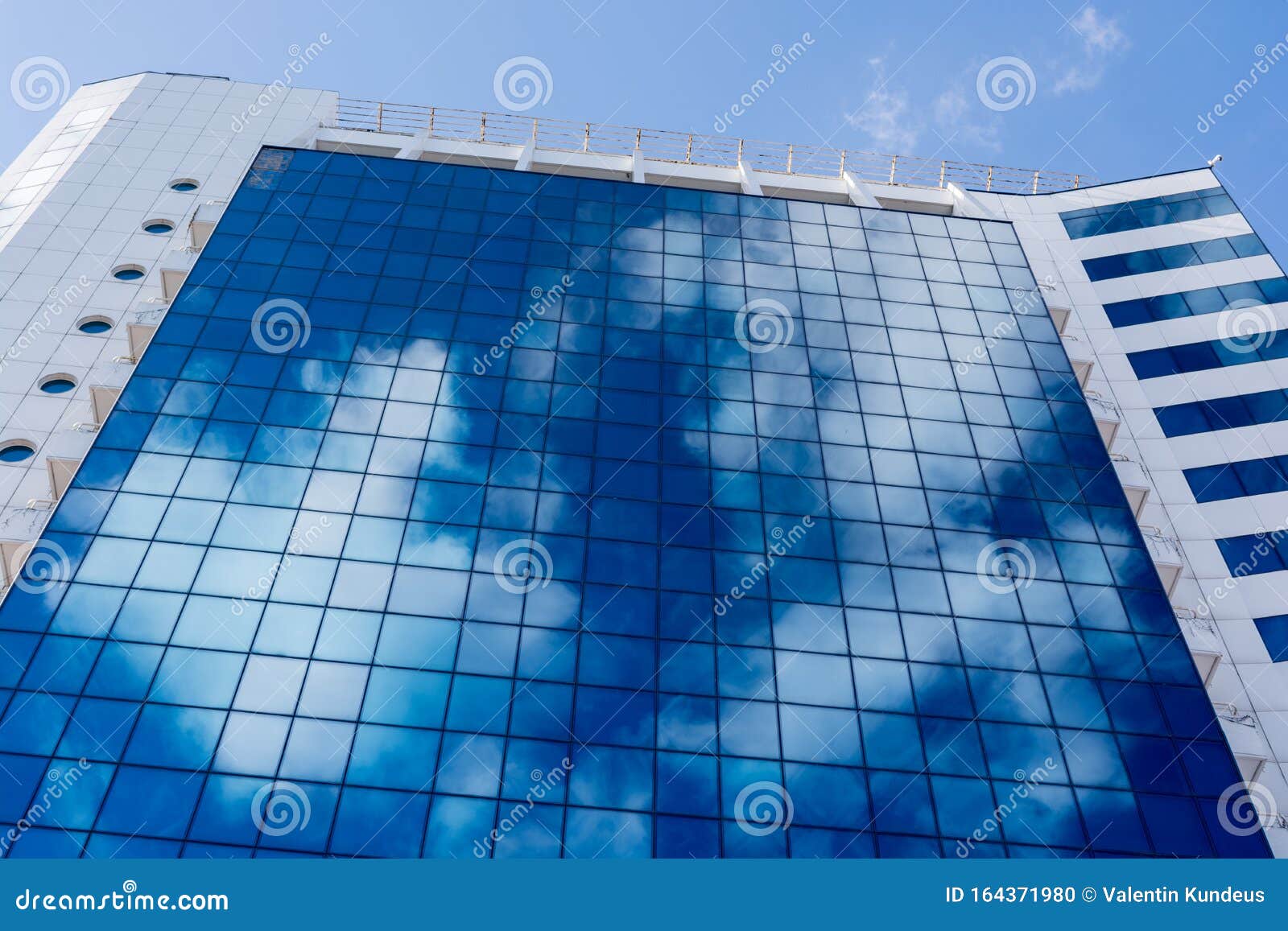 The Glass Facade of a Modern Building. High Building Stock Photo ...