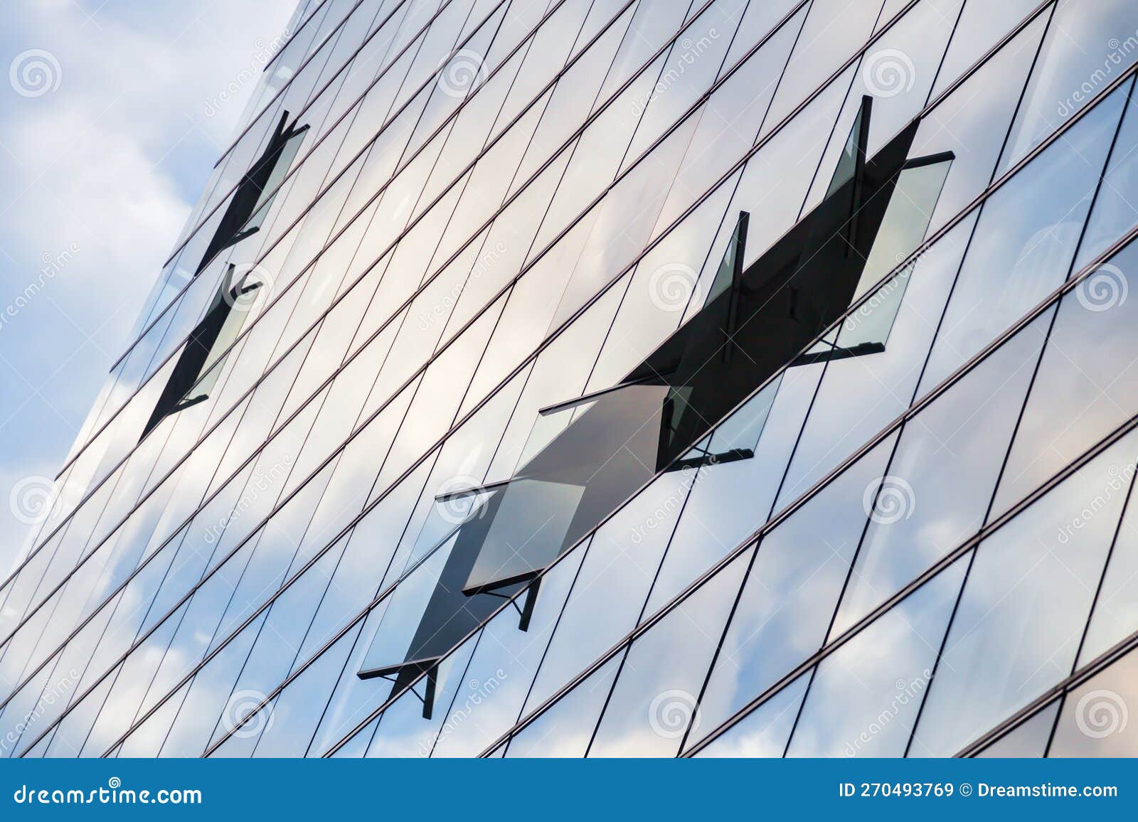 Glass Facade of an Office Building with Reflecting Sky in the Windows ...