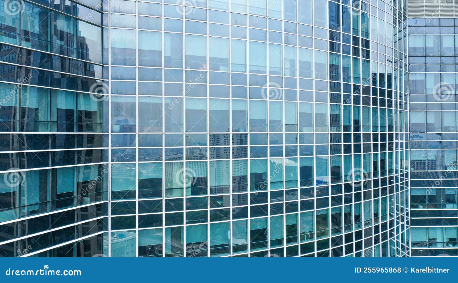 The Glass Facade of a Skyscraper with a Mirror Reflection of Sky ...