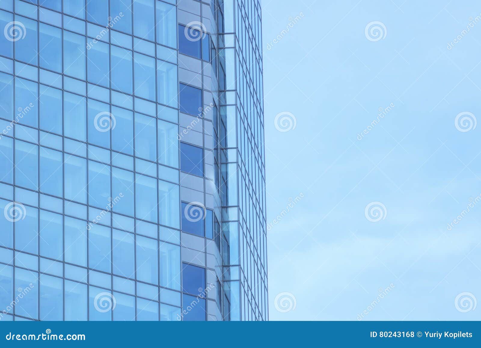 The Glass Facade of a Skyscraper with a Mirror Reflection of Sky ...