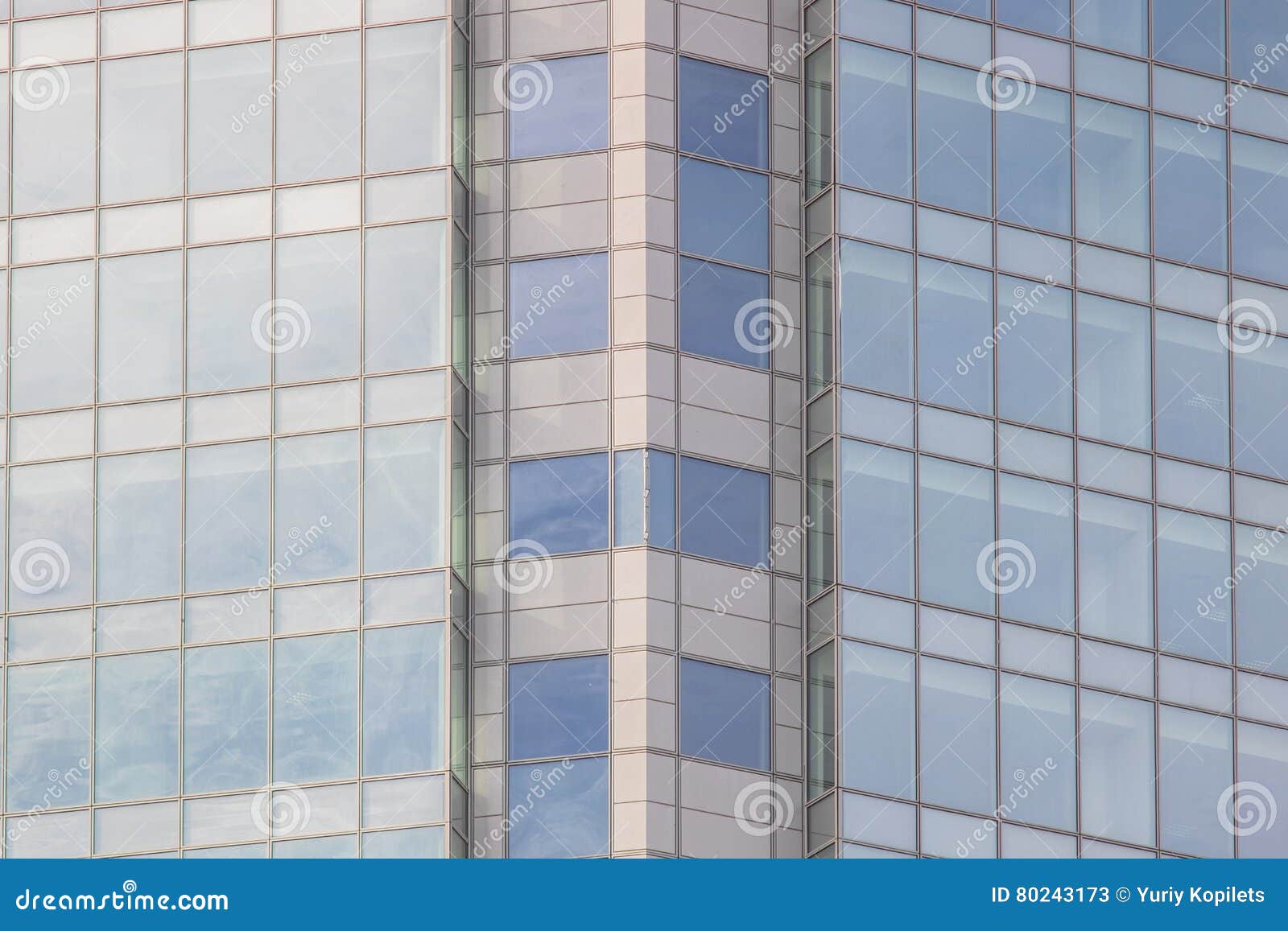 The Glass Facade of a Skyscraper with a Mirror Reflection of Sky ...
