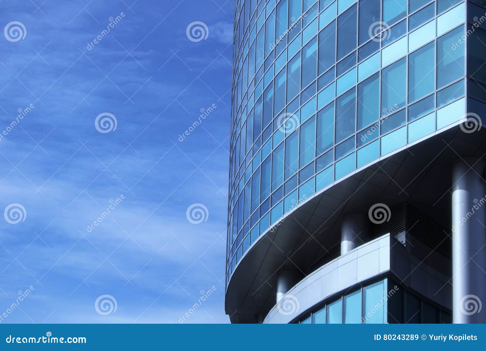 The Glass Facade of a Skyscraper with a Mirror Reflection of Sky ...